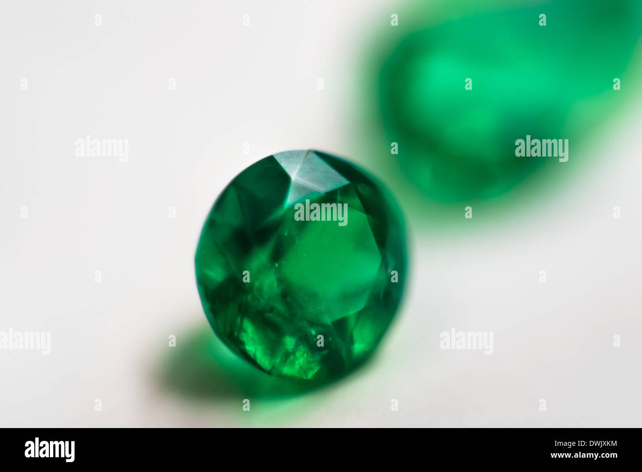 A fine round-shaped emerald, having a value of $5,000-10,000, is seen ...