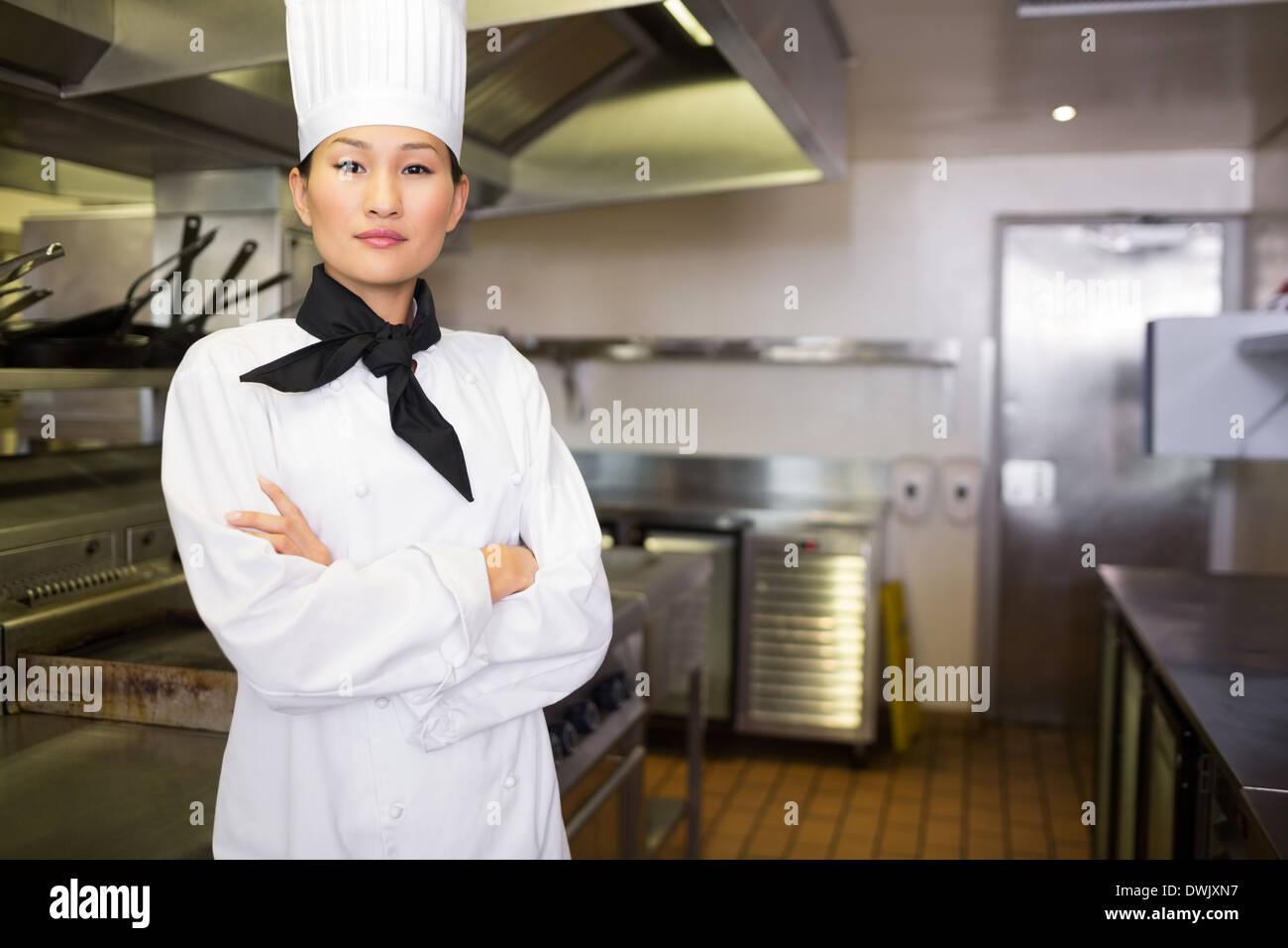 Portrait of confident female cook in kitchen Stock Photo - Alamy