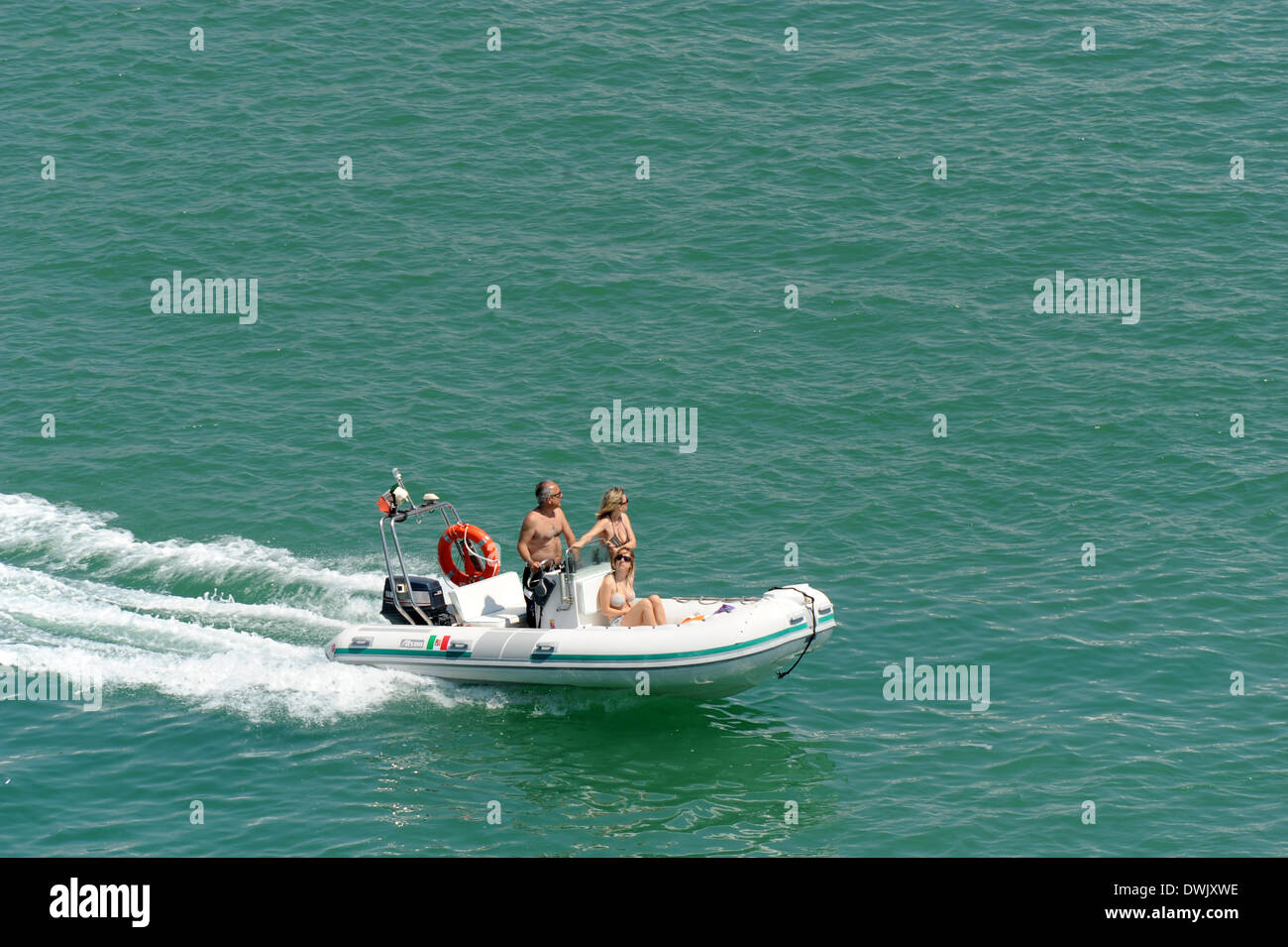 A young couple ride in a speed boat in sunny weather Stock Photo - Alamy