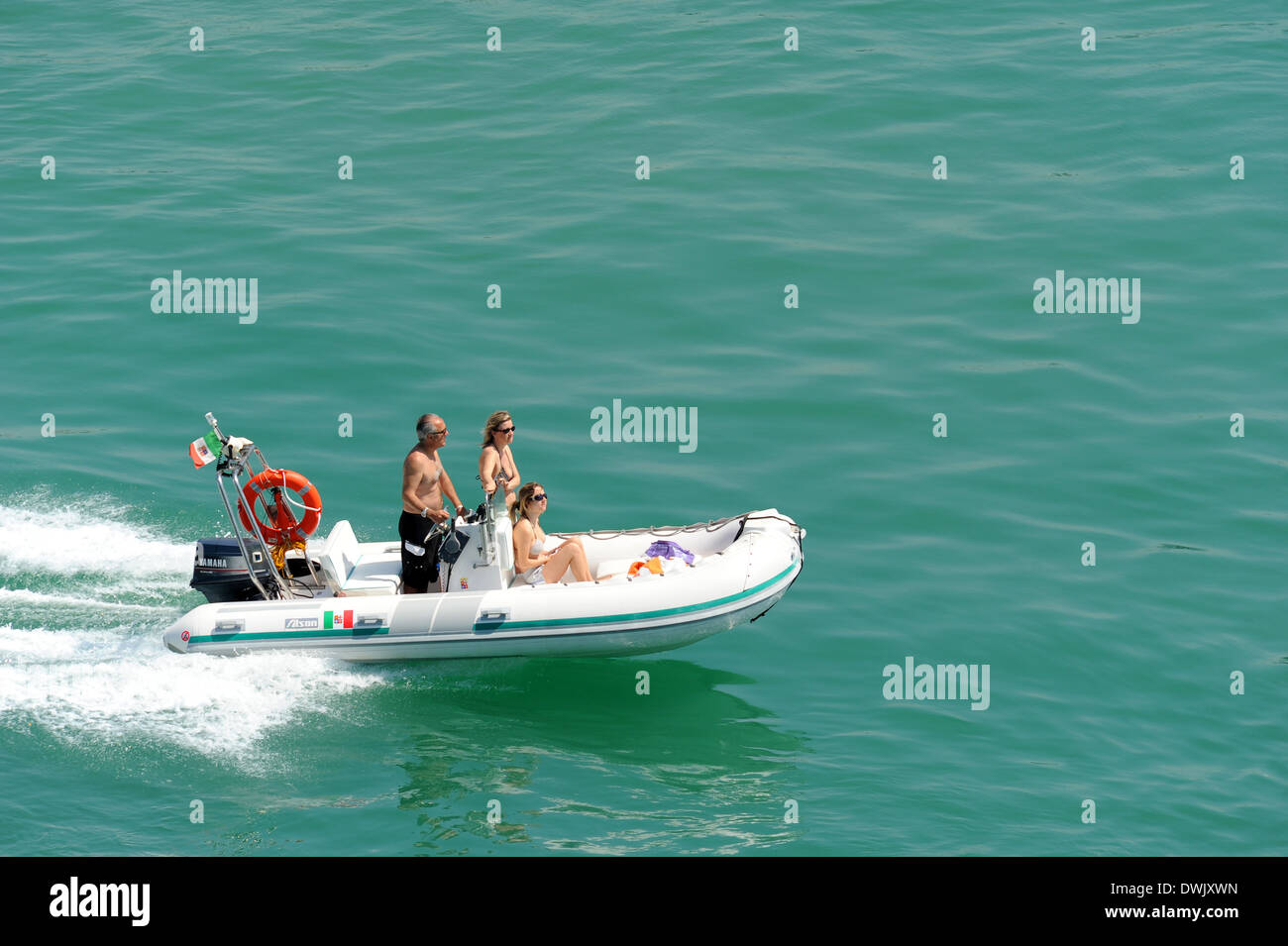 A young couple ride in a speed boat in sunny weather Stock Photo - Alamy