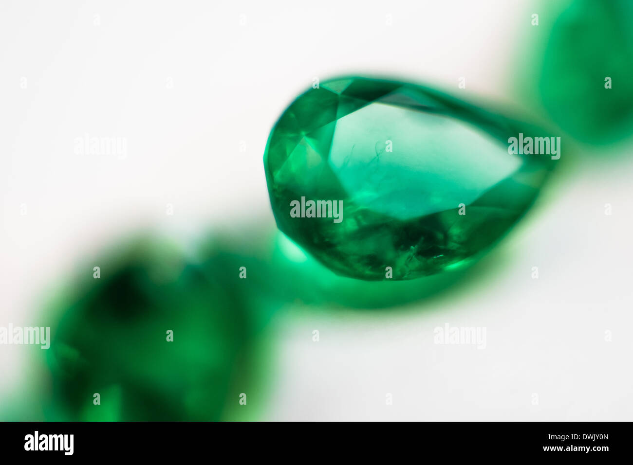 A fine teardrop-shaped emerald, having a value of $5,000-10,000, is ...