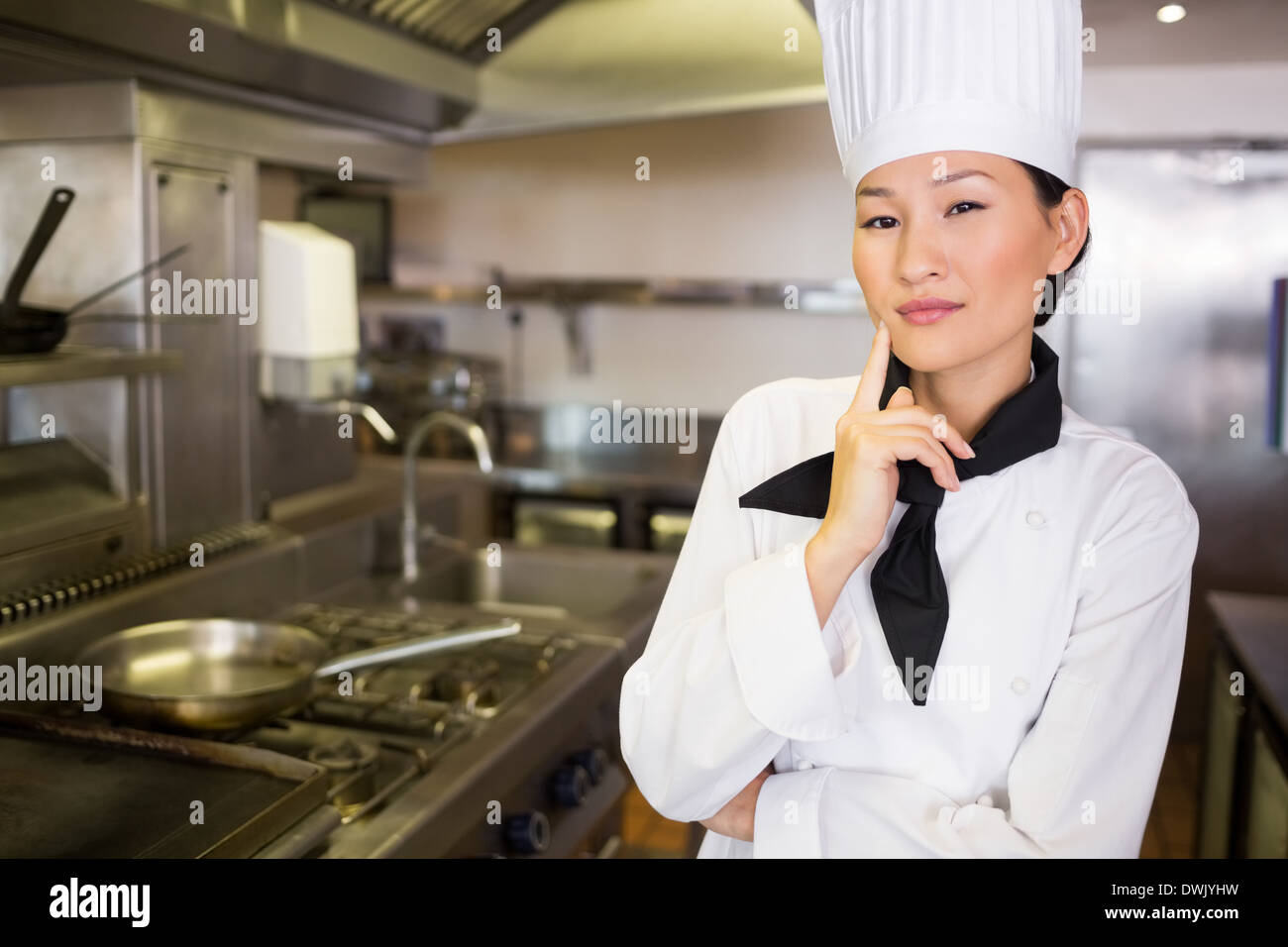 Portrait of confident female cook in kitchen Stock Photo - Alamy