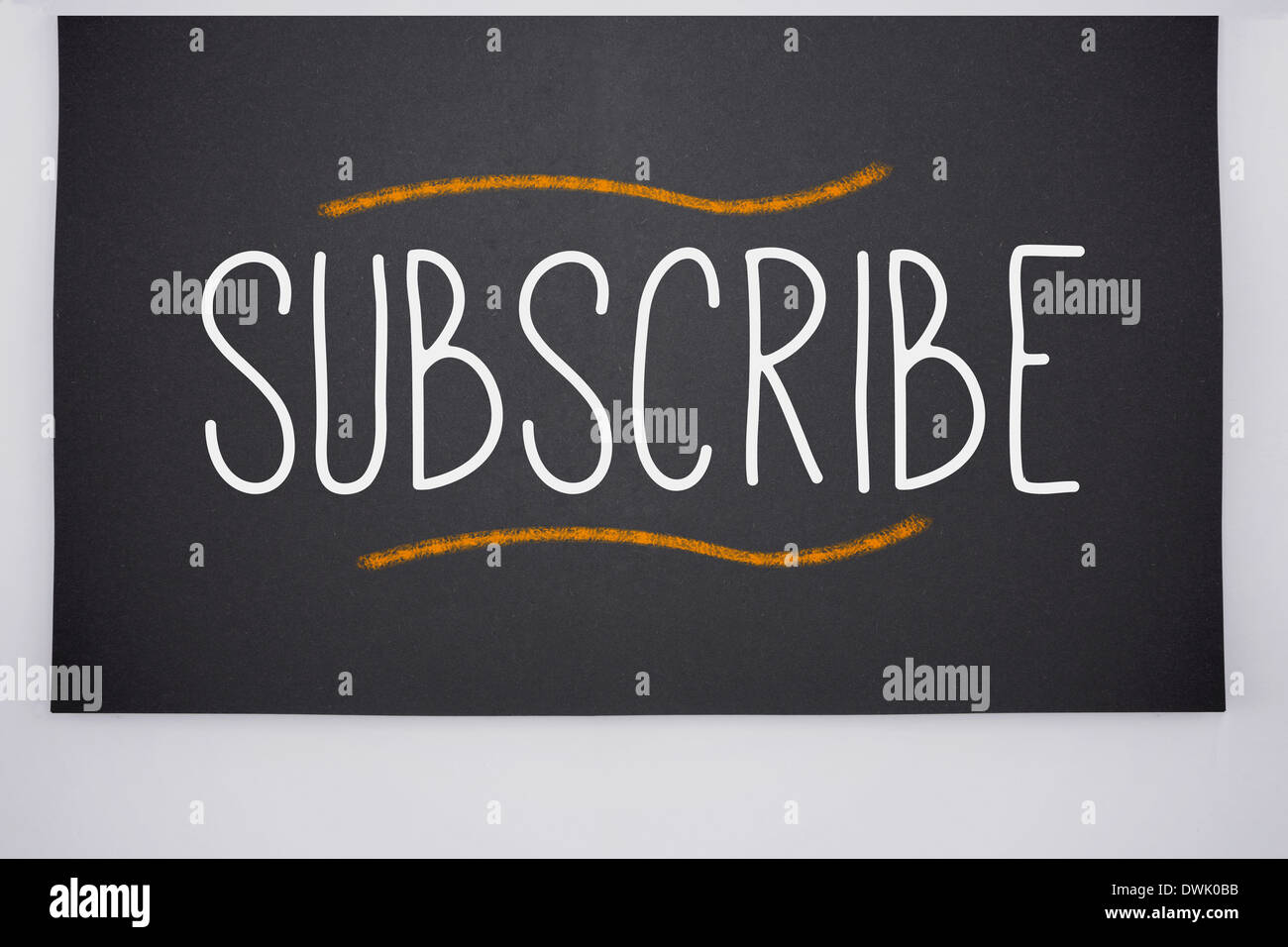 Subscribe written on big blackboard Stock Photo - Alamy