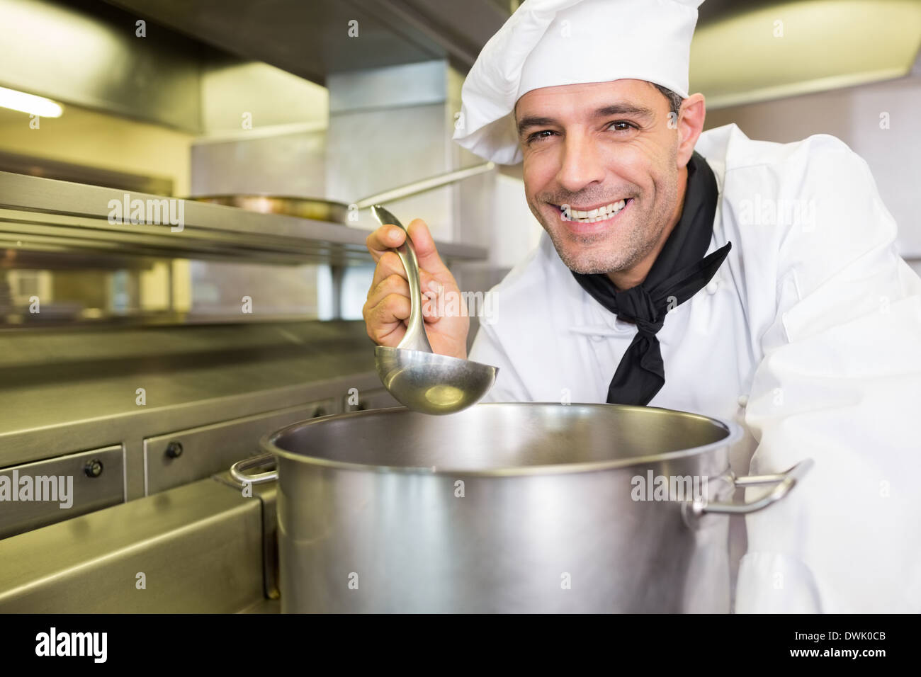 Smiling male cook tasting hi-res stock photography and images - Alamy
