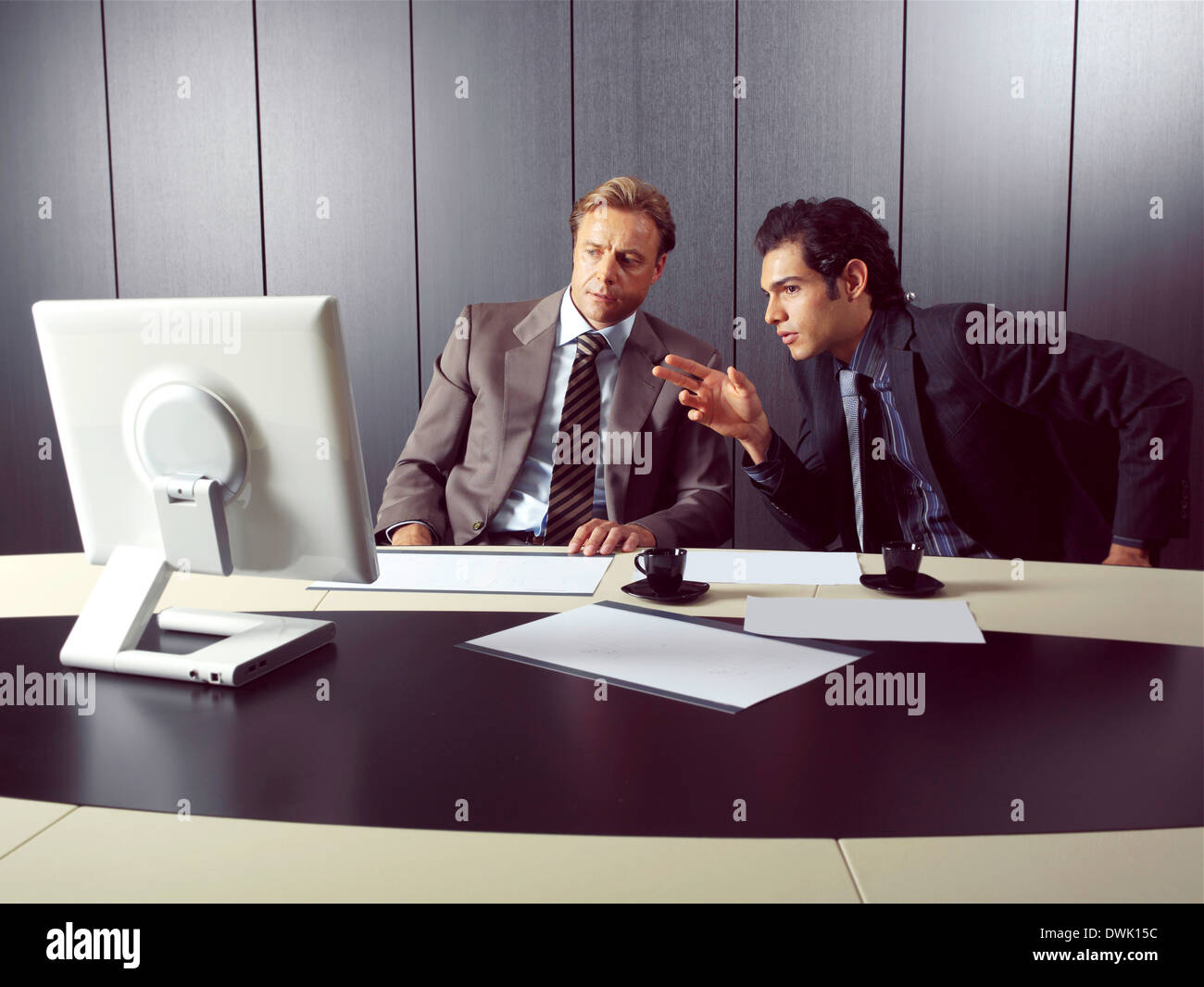 Two men computer looking monitor hi-res stock photography and images ...