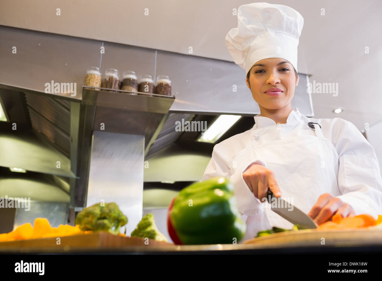 Female chef cutting vegetables in hi-res stock photography and images ...