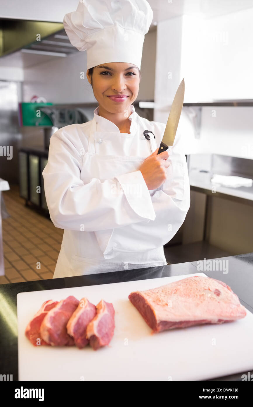 Professional chef cutting fresh meat hi-res stock photography and ...