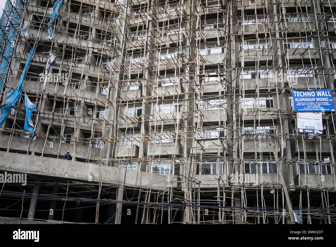 scaffolding on building in Africa. Using wood and branches to construct ...