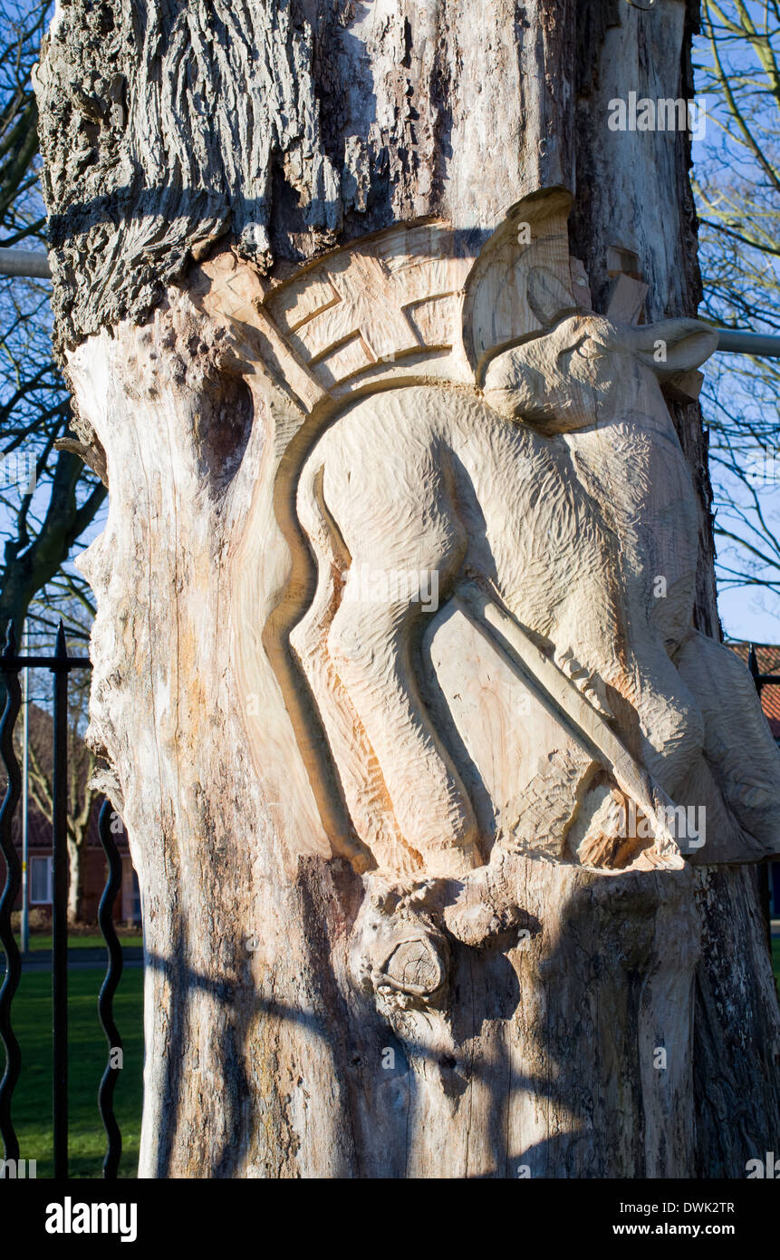 Lamb carved into tree trunk Stock Photo - Alamy