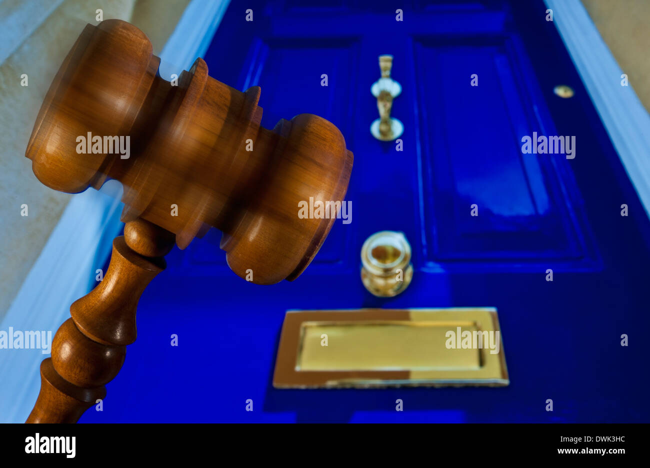 House sale by auction concept, auctioneers hammer with motion blur ...