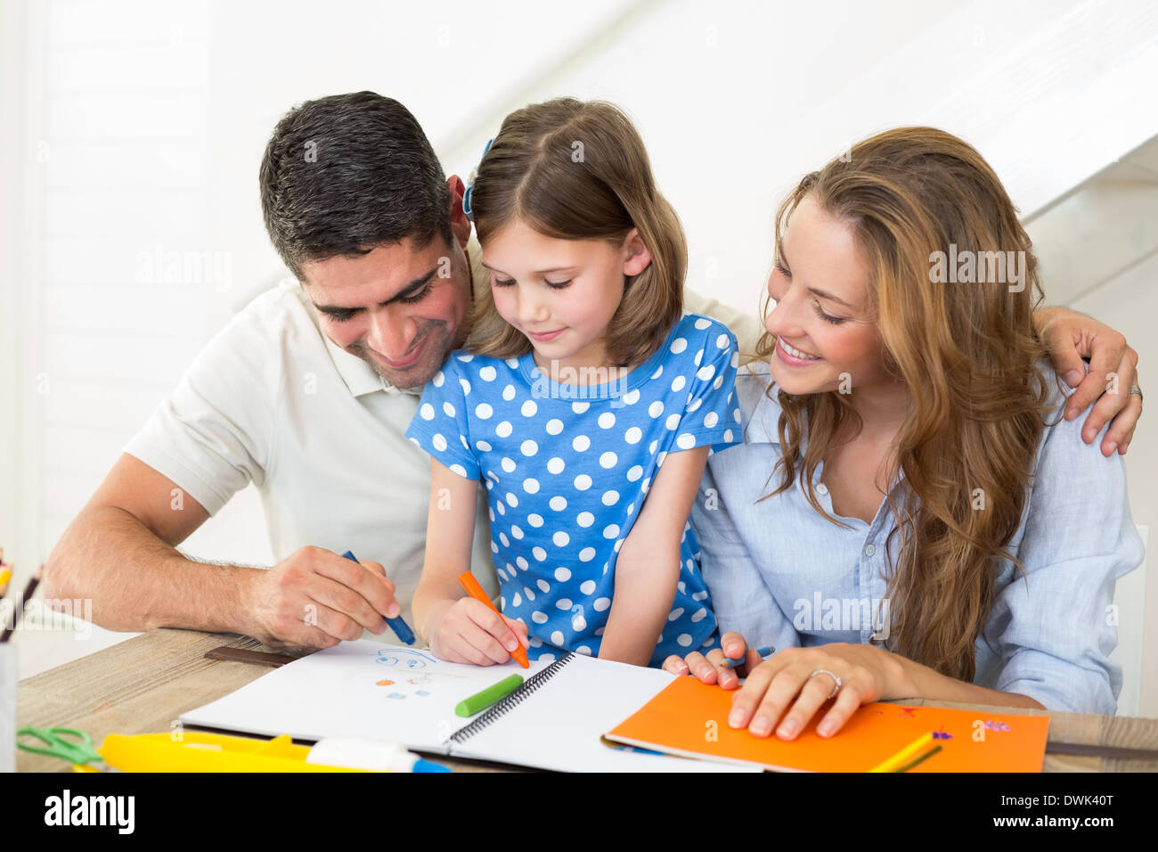 Family coloring at home Stock Photo - Alamy