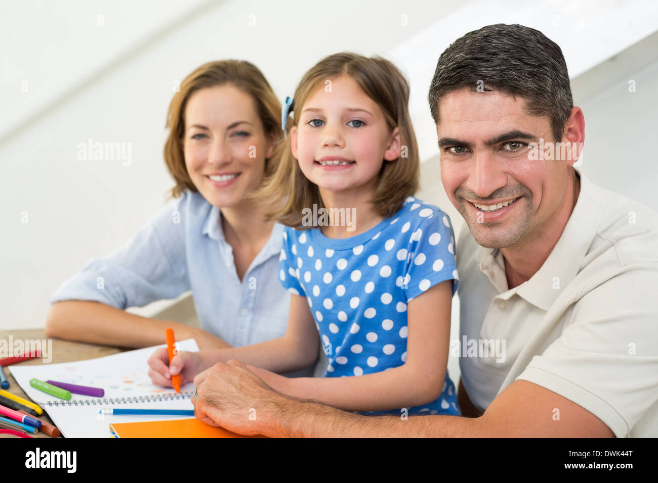 Portrait of family coloring at home Stock Photo - Alamy