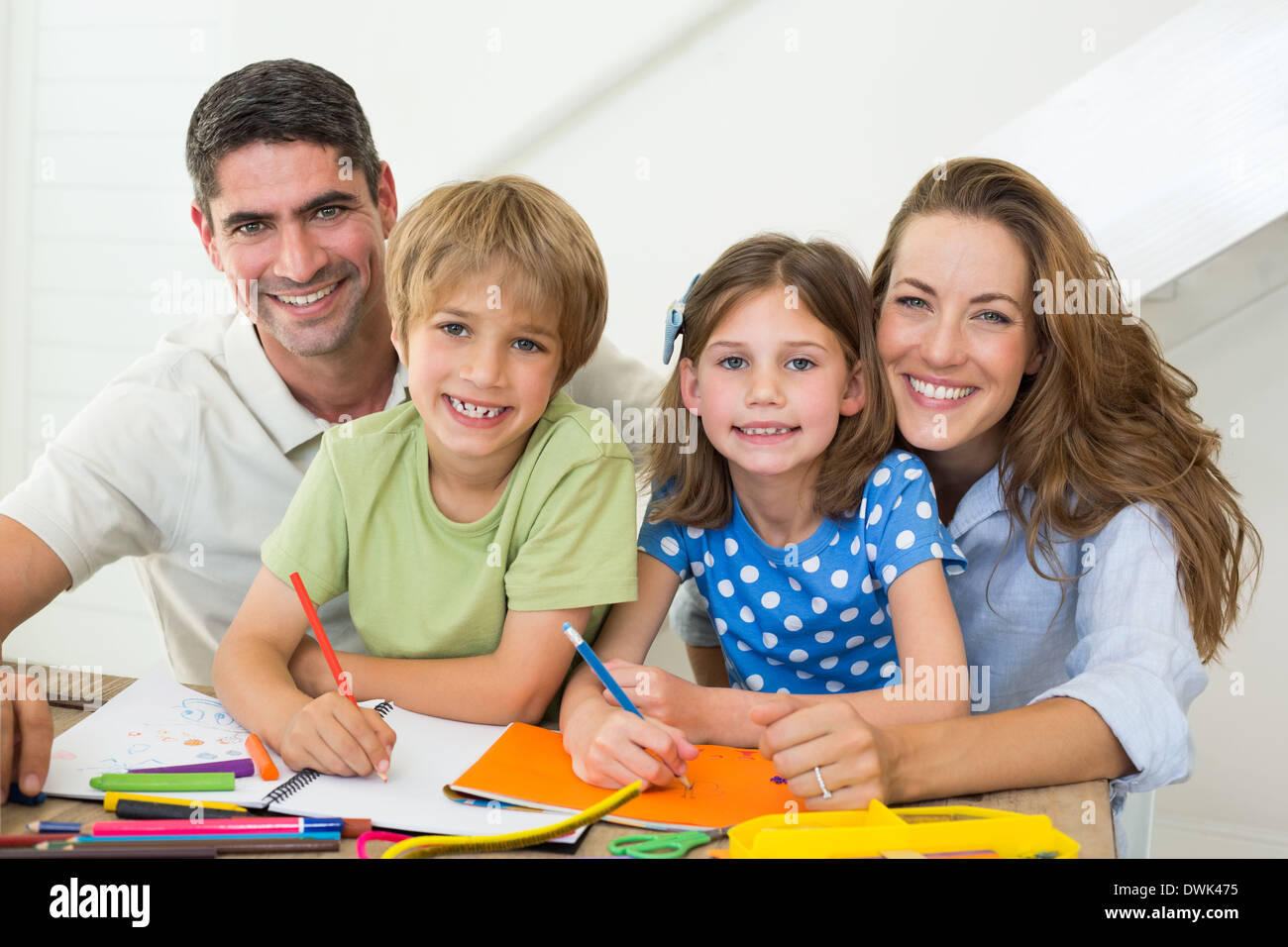 Parents with children drawing at home Stock Photo - Alamy