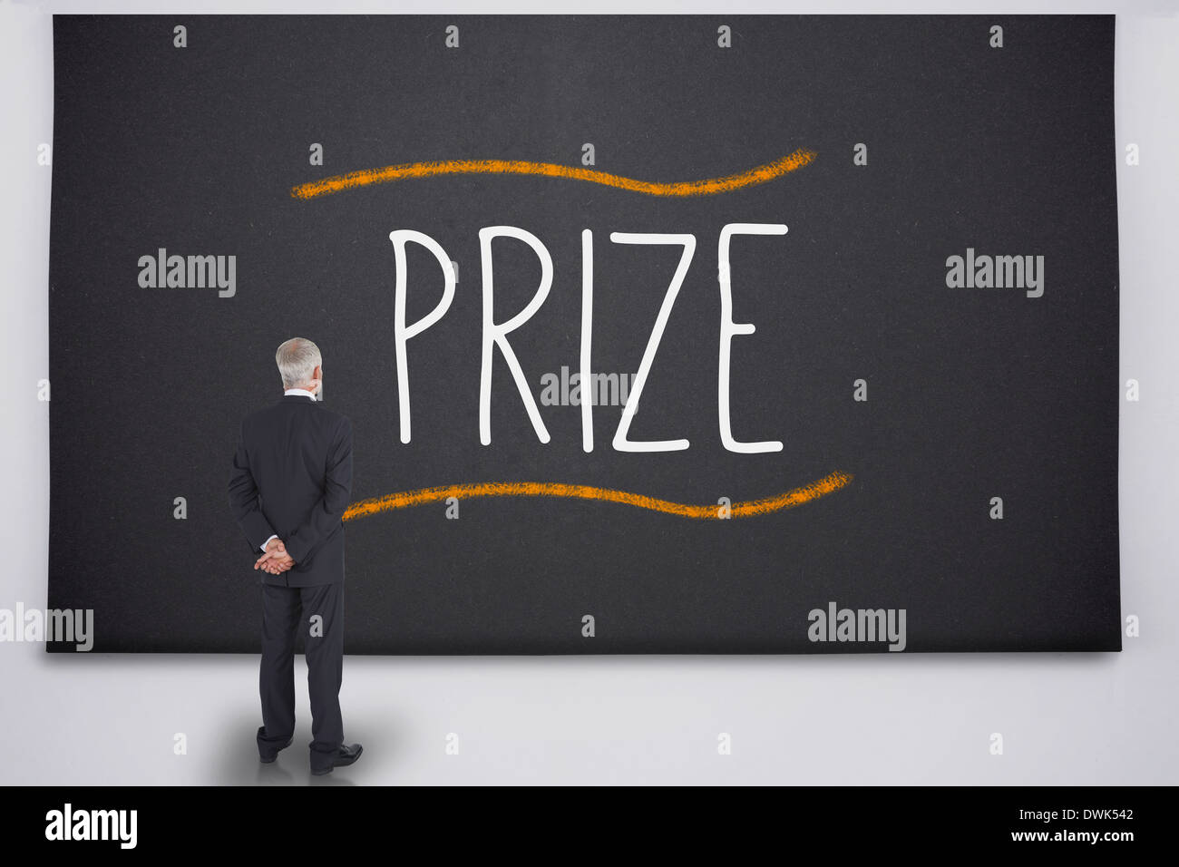 Businessman reading the word prize Stock Photo - Alamy