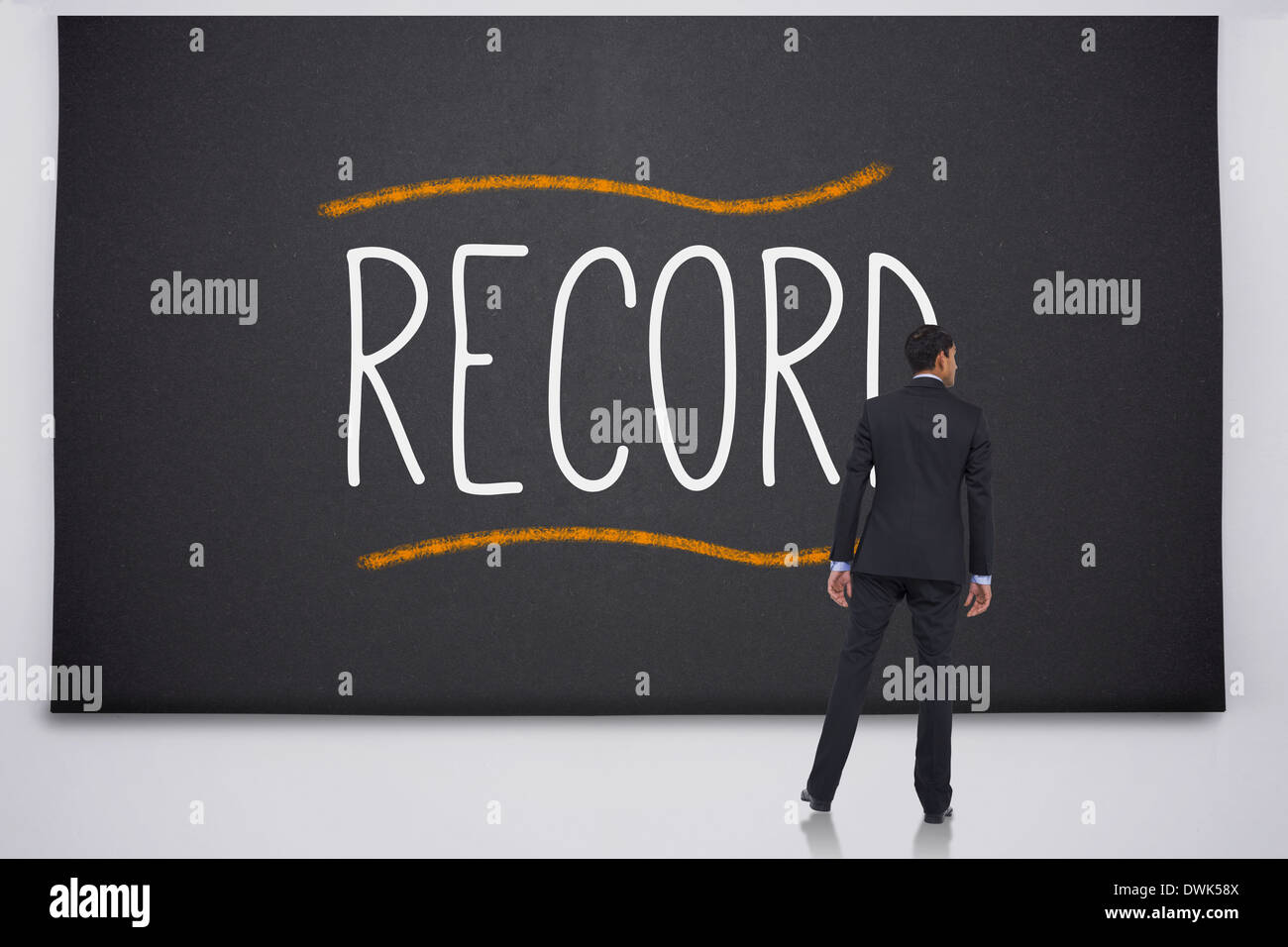 Businessman reading the word record Stock Photo - Alamy