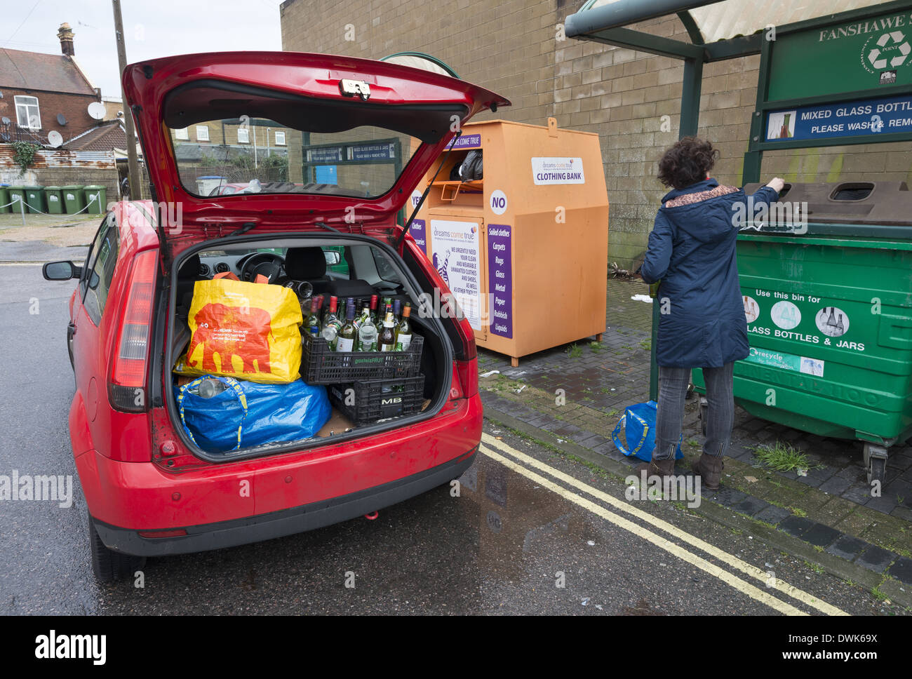 Women with a car boot full of bottles at a recycling bottle bank Stock ...