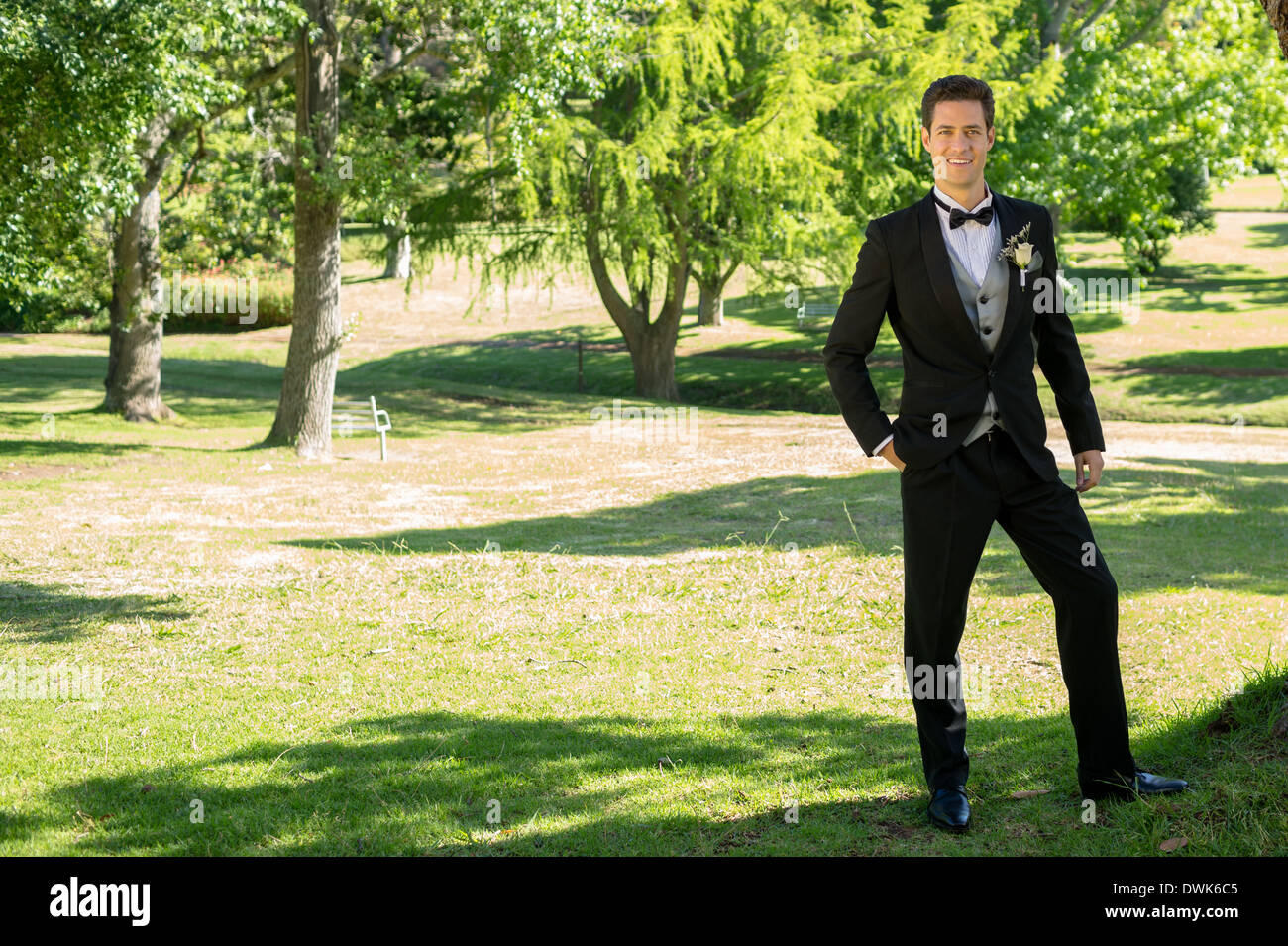Confident groom standing in garden Stock Photo - Alamy