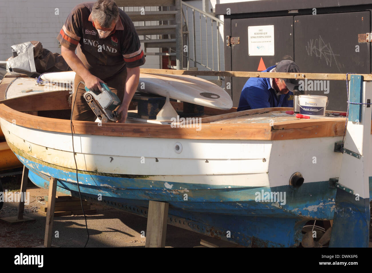 Repairing a small clinker built fishing boat Stock Photo - Alamy