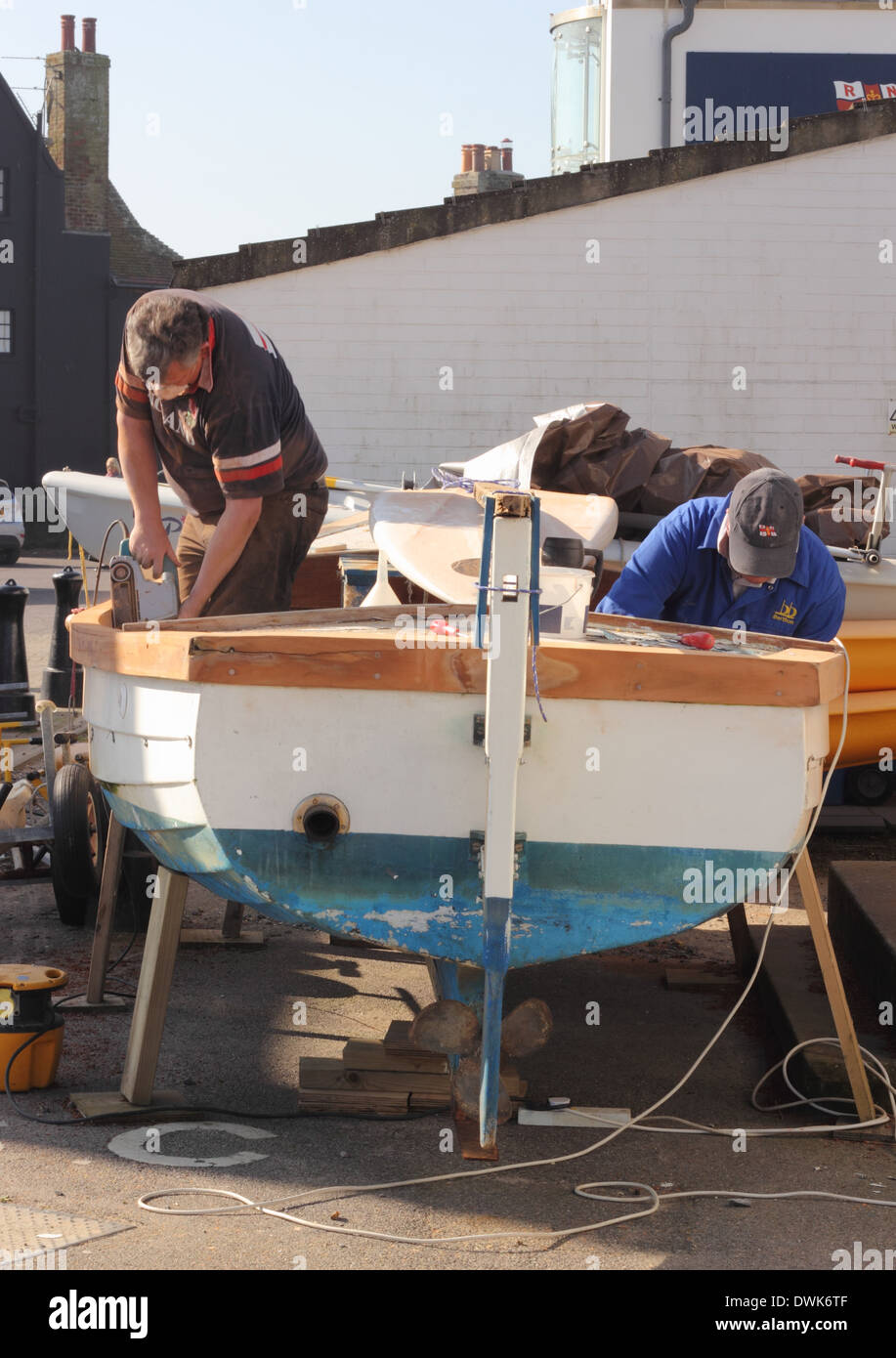 Repairing a small clinker built fishing boat Stock Photo - Alamy