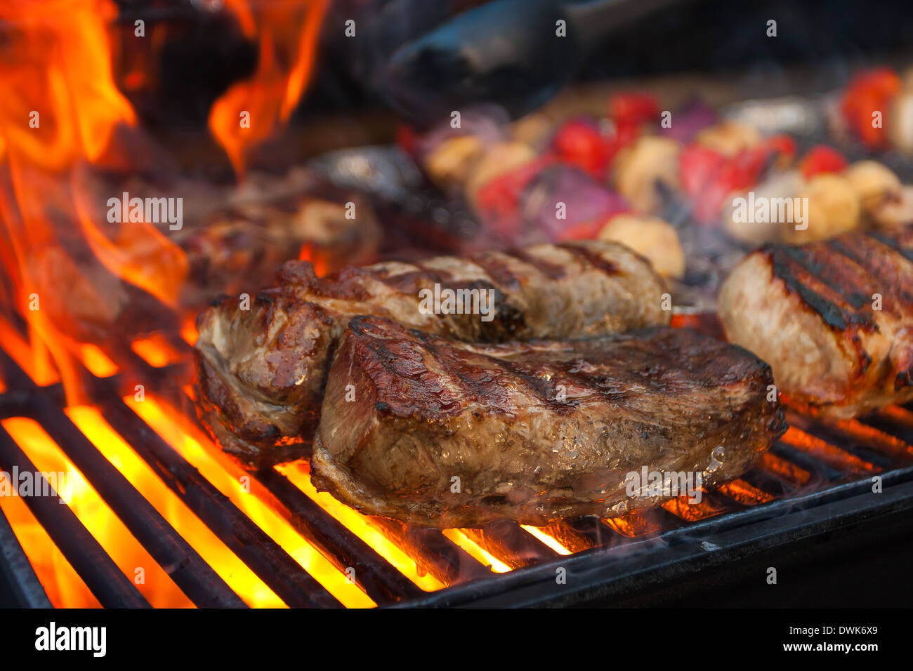 Meat and vegetables char-grilled over flame Stock Photo - Alamy
