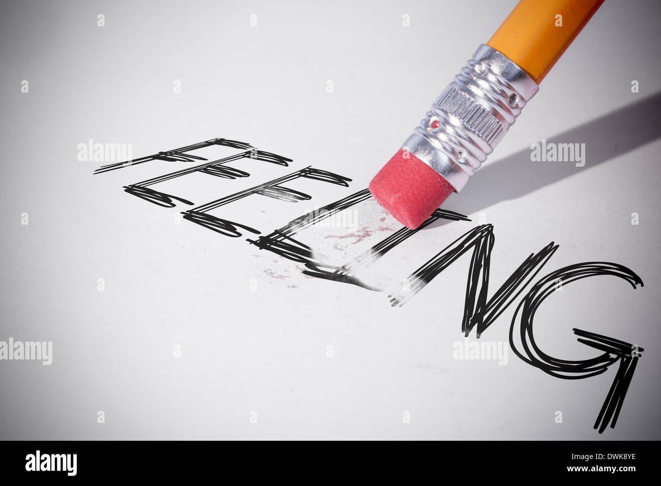 Pencil erasing the word Feeling Stock Photo - Alamy