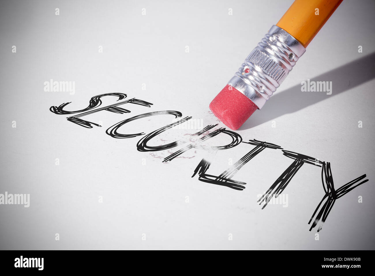 Pencil erasing the word Security Stock Photo - Alamy