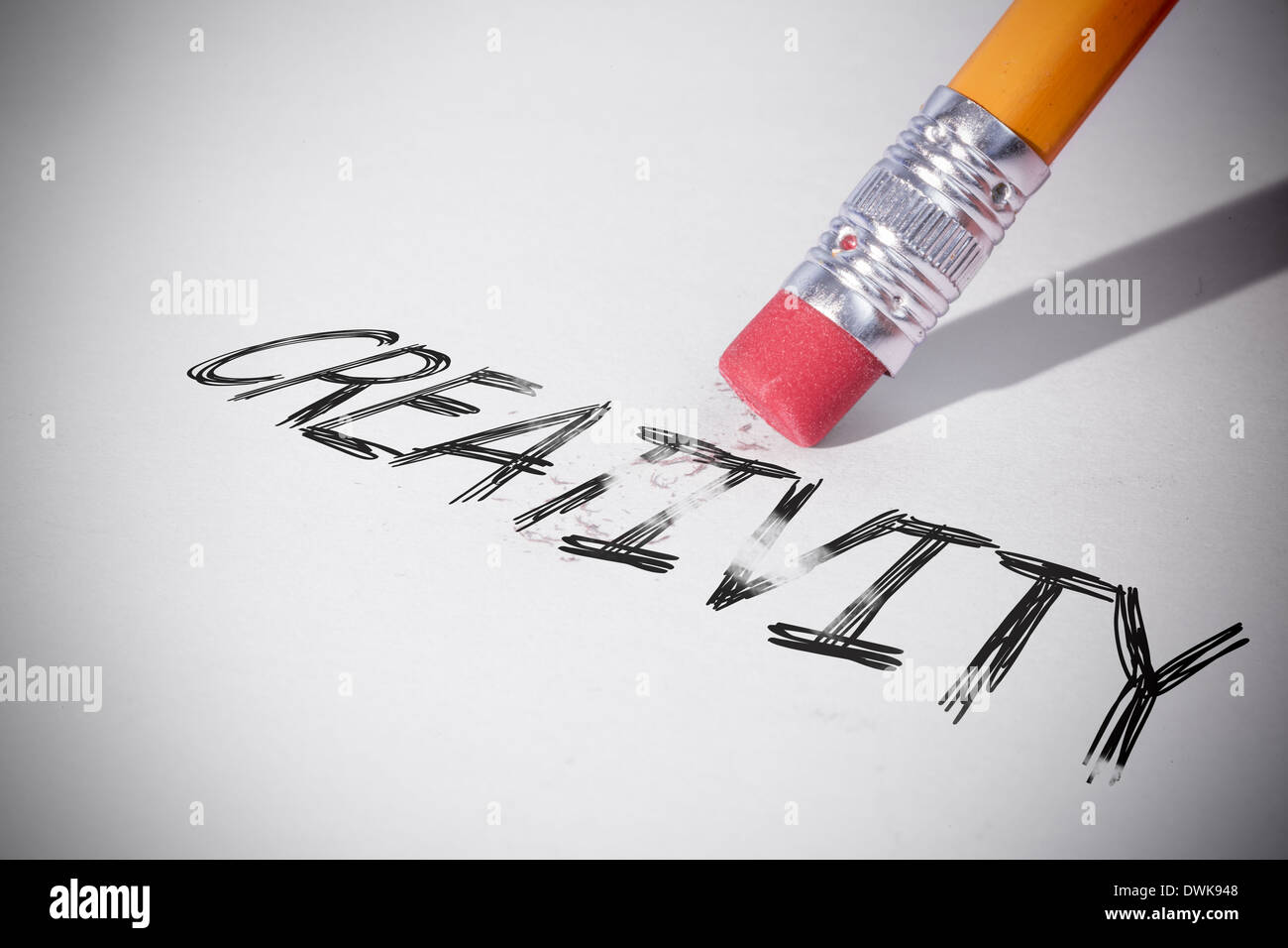 Pencil erasing the word Creativity Stock Photo - Alamy