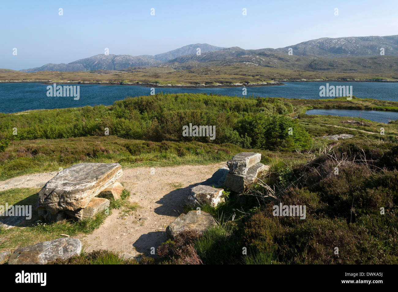 Stone table and benches at a picnic area on the path on the north coast ...