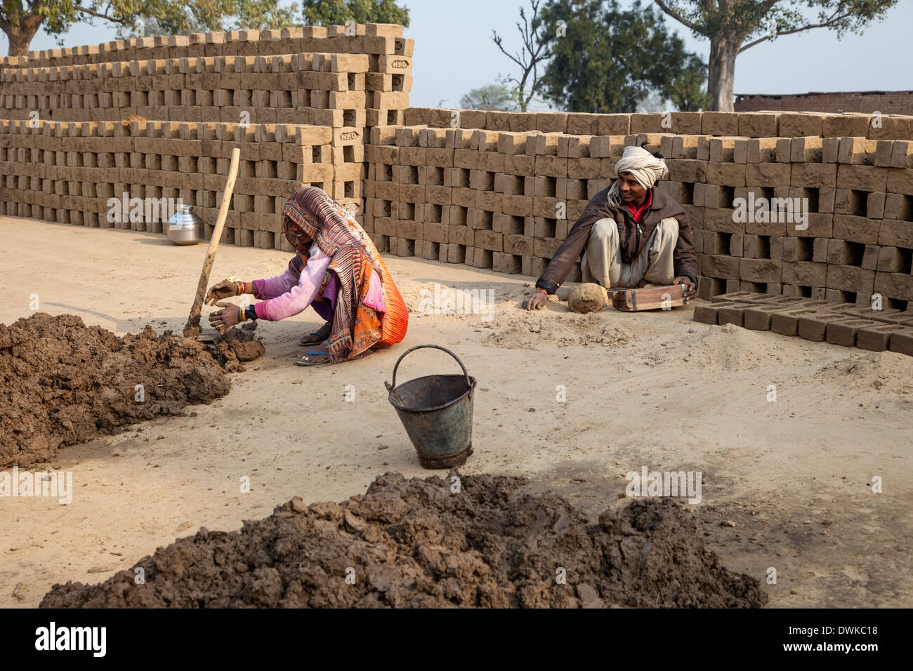 Rajasthan, India. Wife Prepares Soft Mud while Husband Puts it into ...