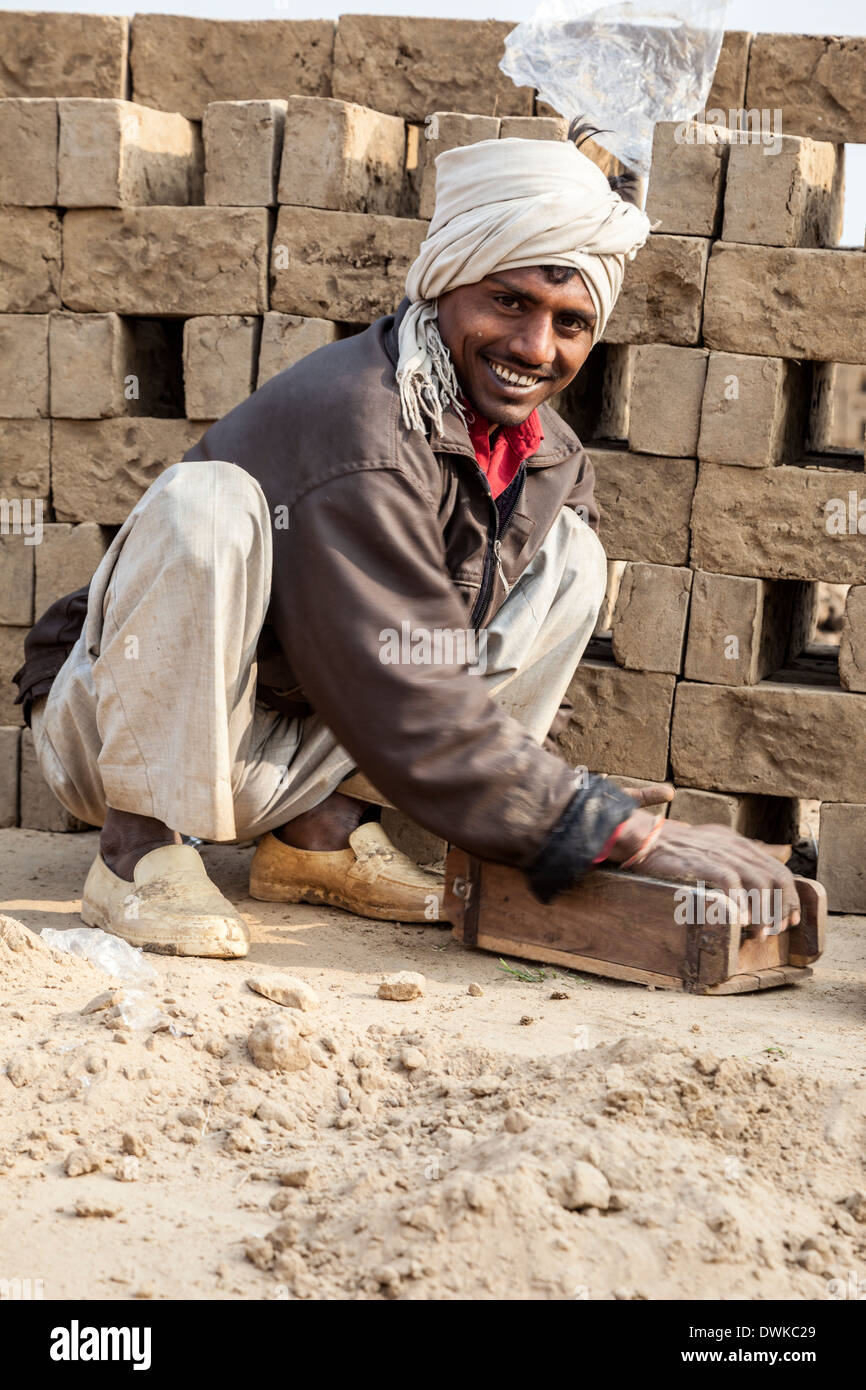 Man making mud bricks hi-res stock photography and images - Alamy