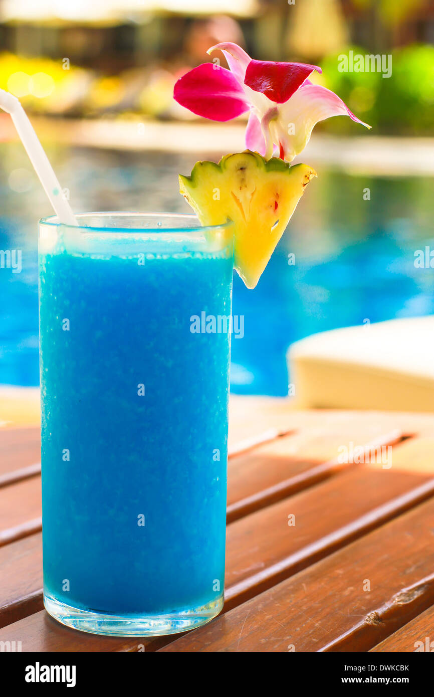 Tropical blue cocktail on a beach near swimming pool Stock Photo - Alamy