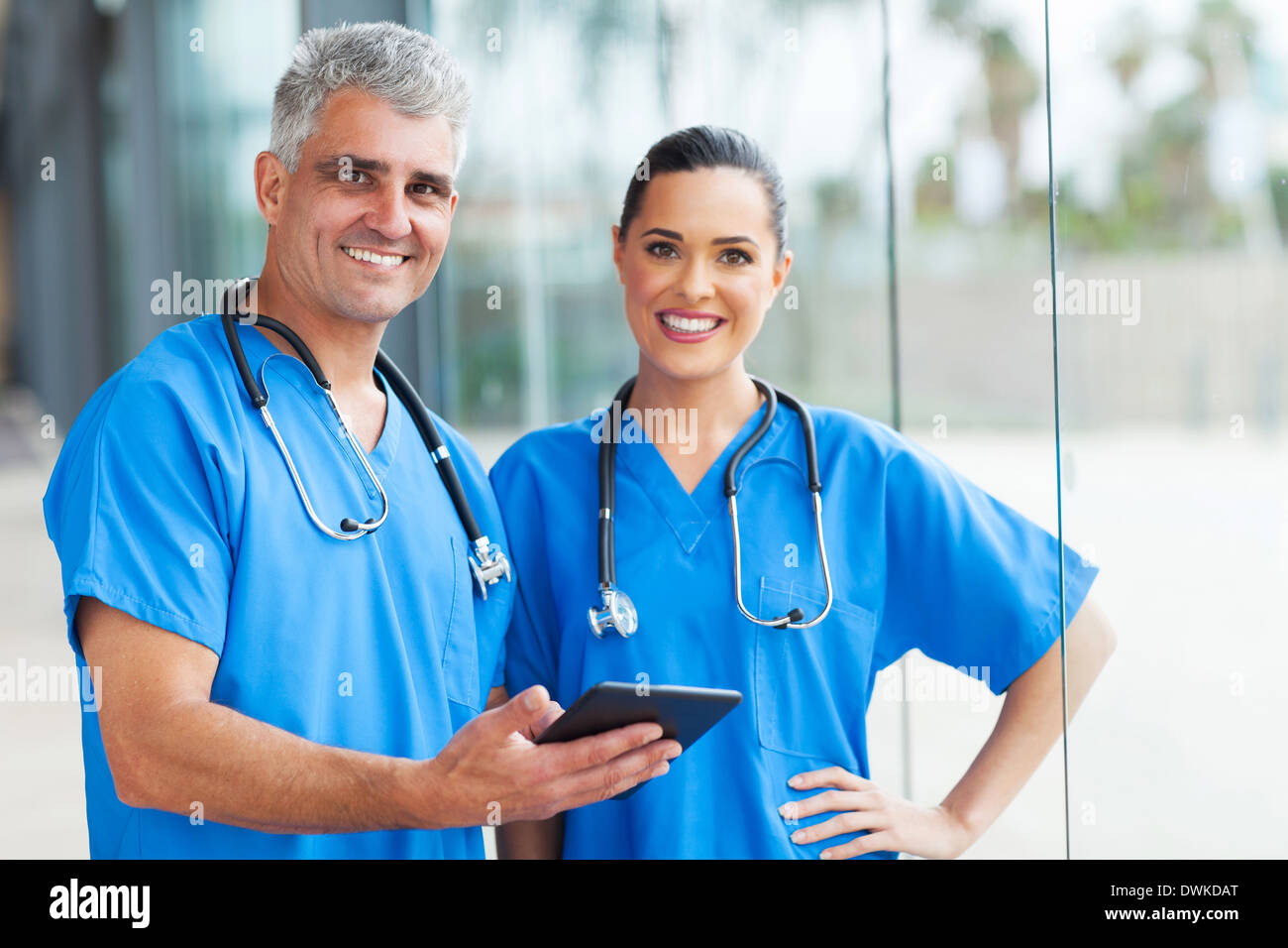 two medical doctors using tablet pc in hospital Stock Photo - Alamy