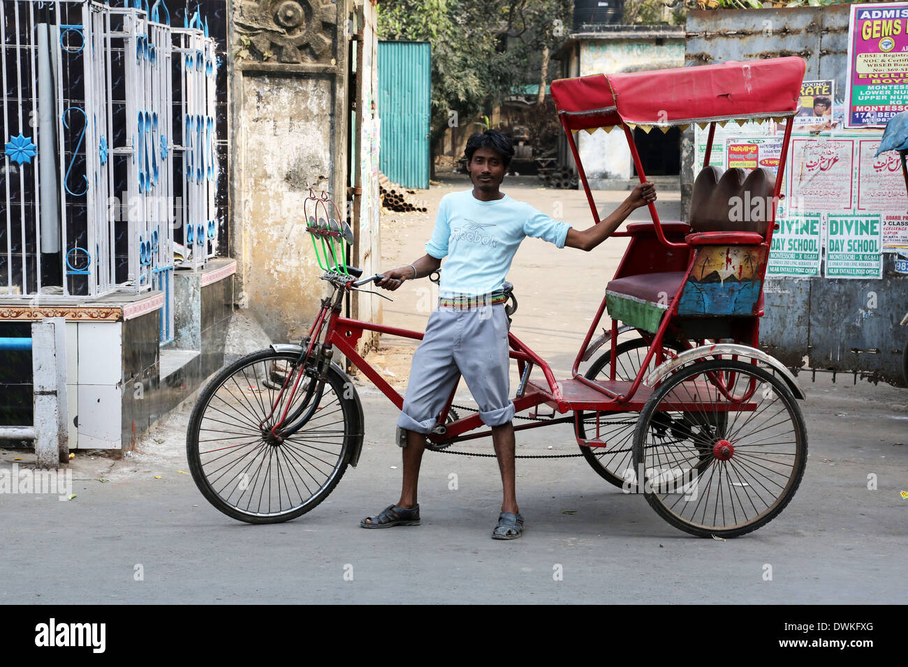 Rickshaw driver wait for passengers on their rickshaw in Kolkata, India ...