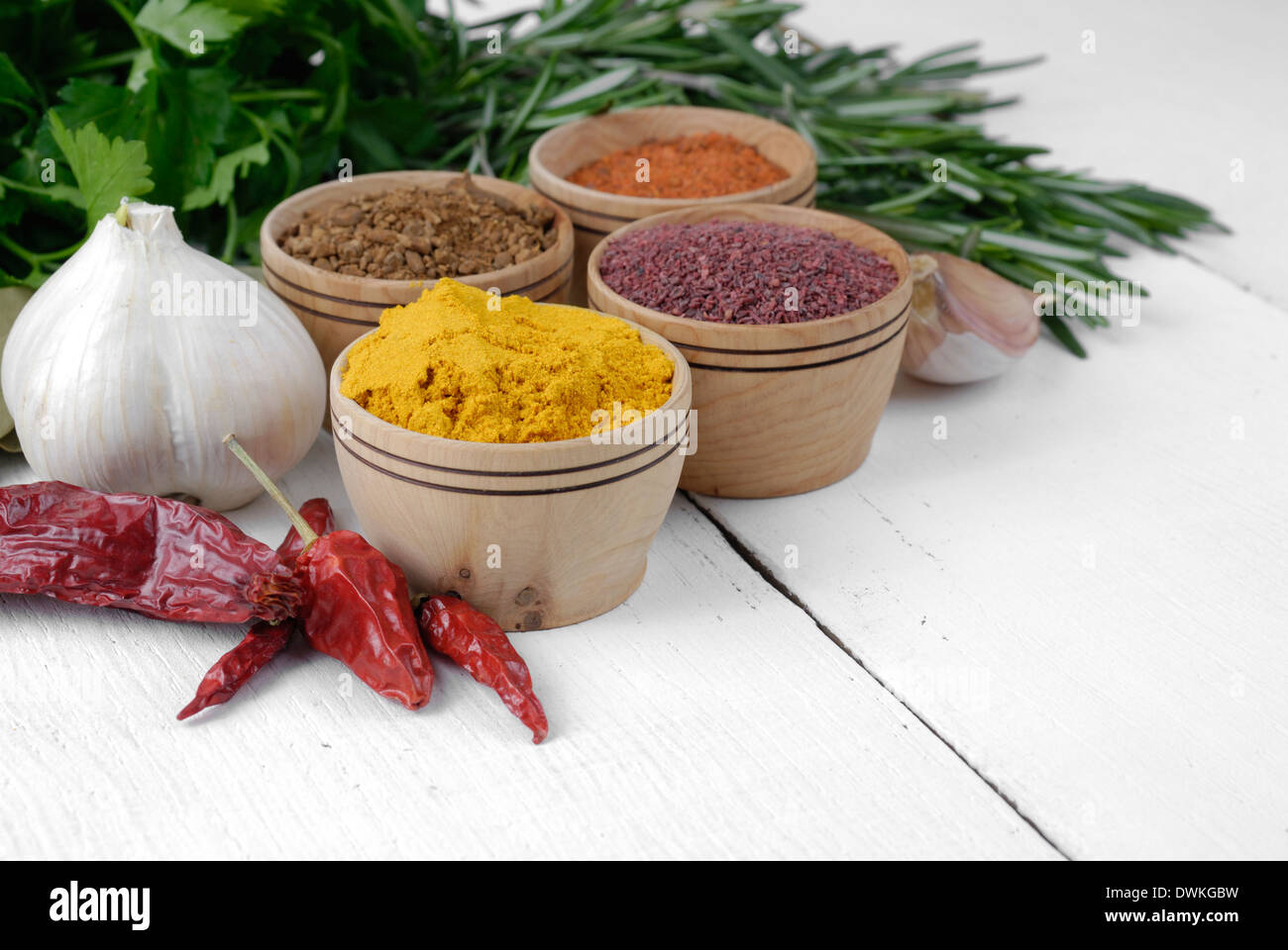 Different kinds of seasonings and herbs on the white oak table Stock ...