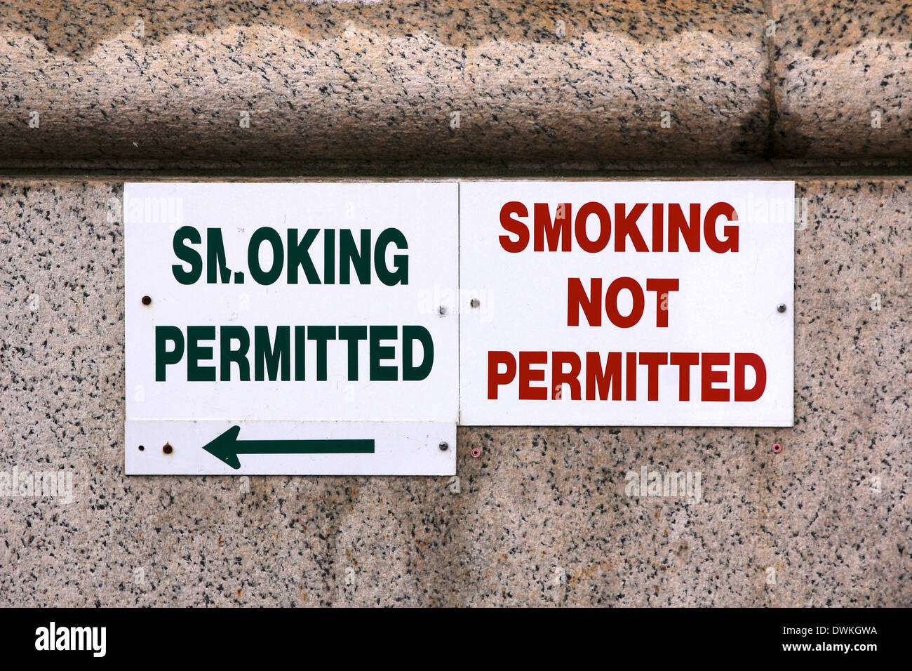 Two signs marking the border between the smoking and the non-smoking ...