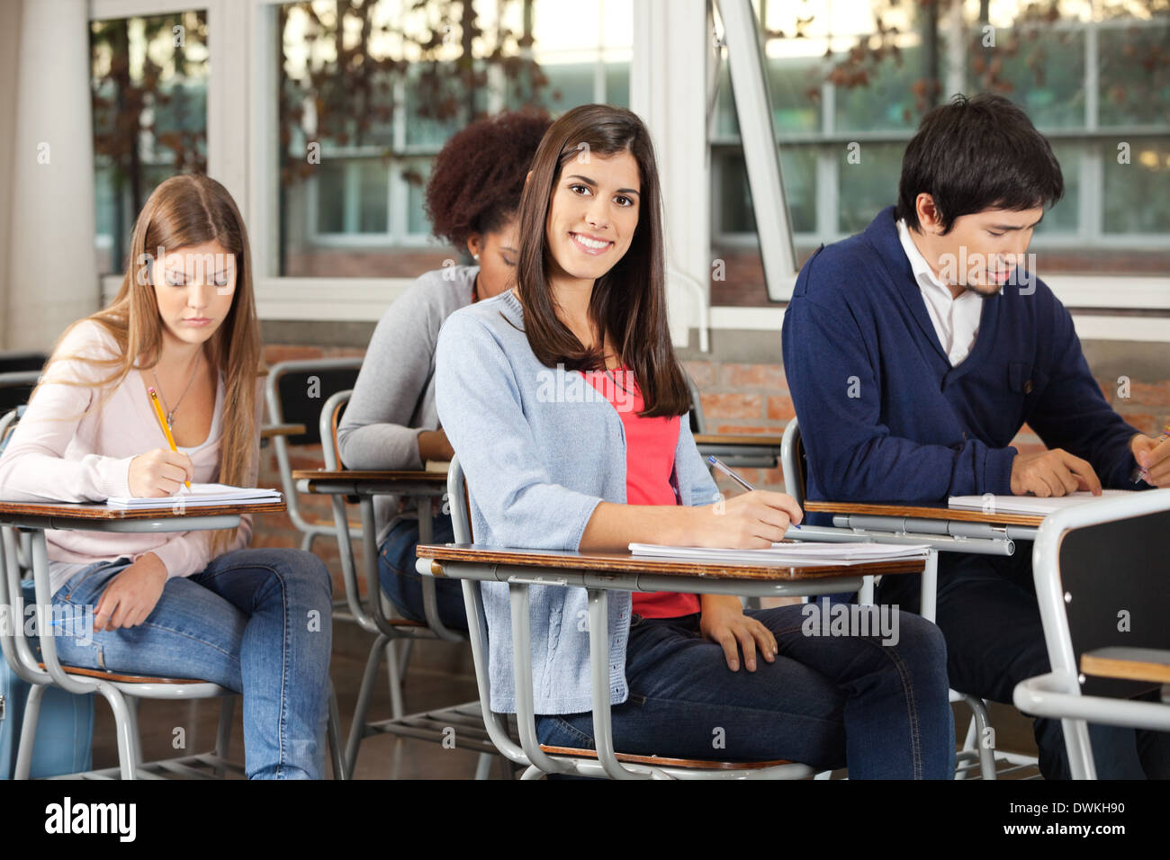 Multiethnic students writing test hi-res stock photography and images ...