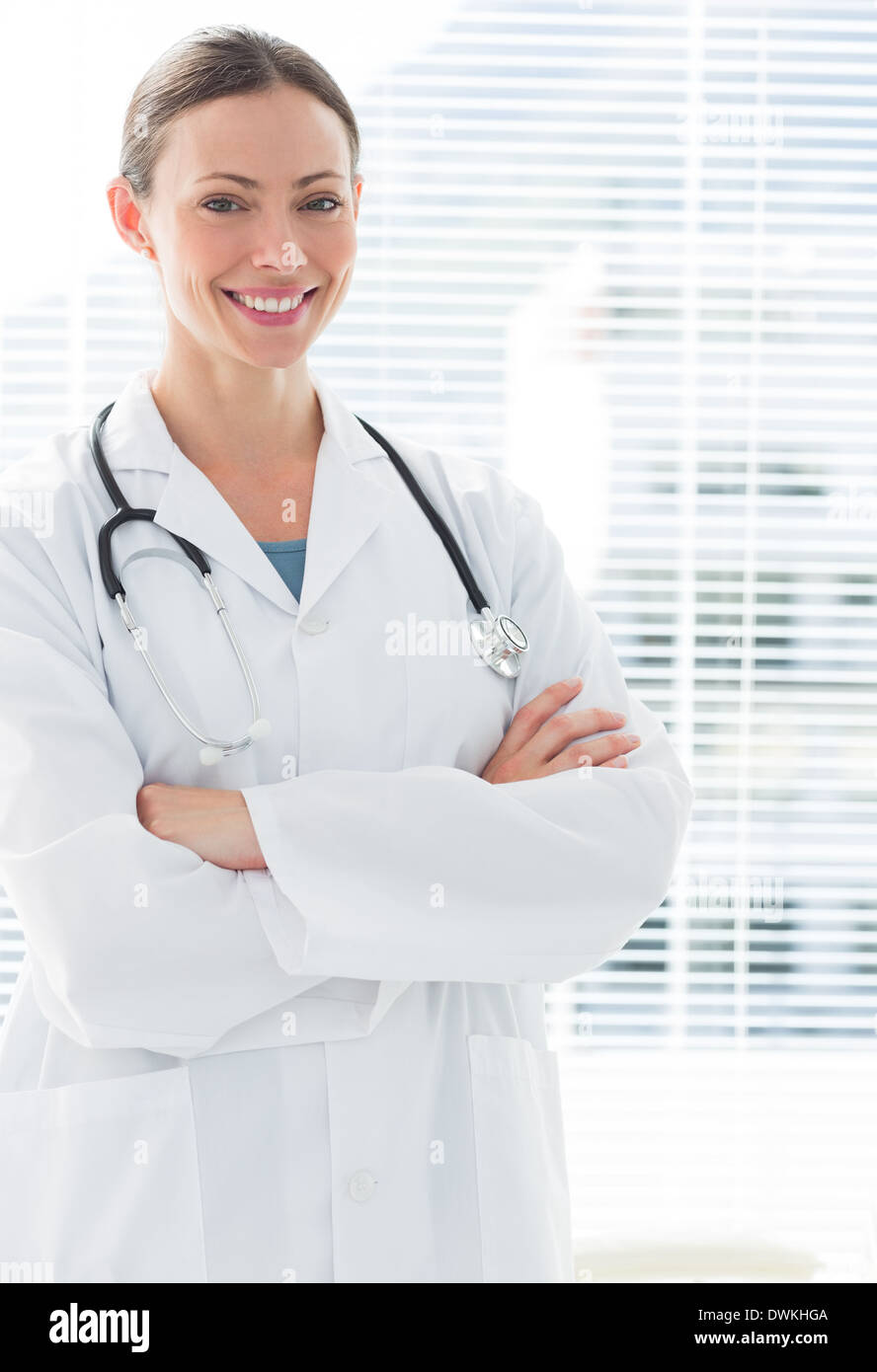 Confident female doctor standing arms crossed Stock Photo - Alamy