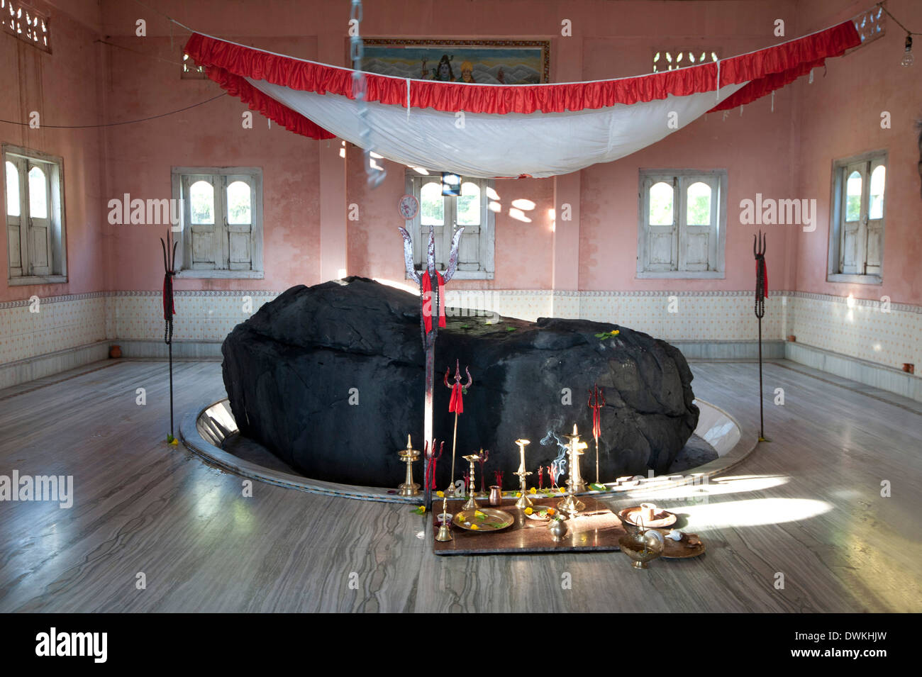 Holy rock from the Brahmaputra in the centre of village Shiva temple on ...
