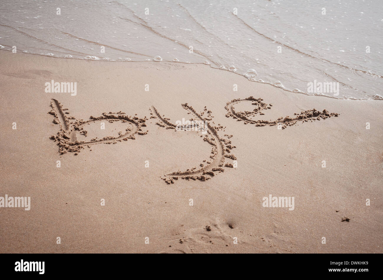 Bye written on sand in hi-res stock photography and images - Alamy