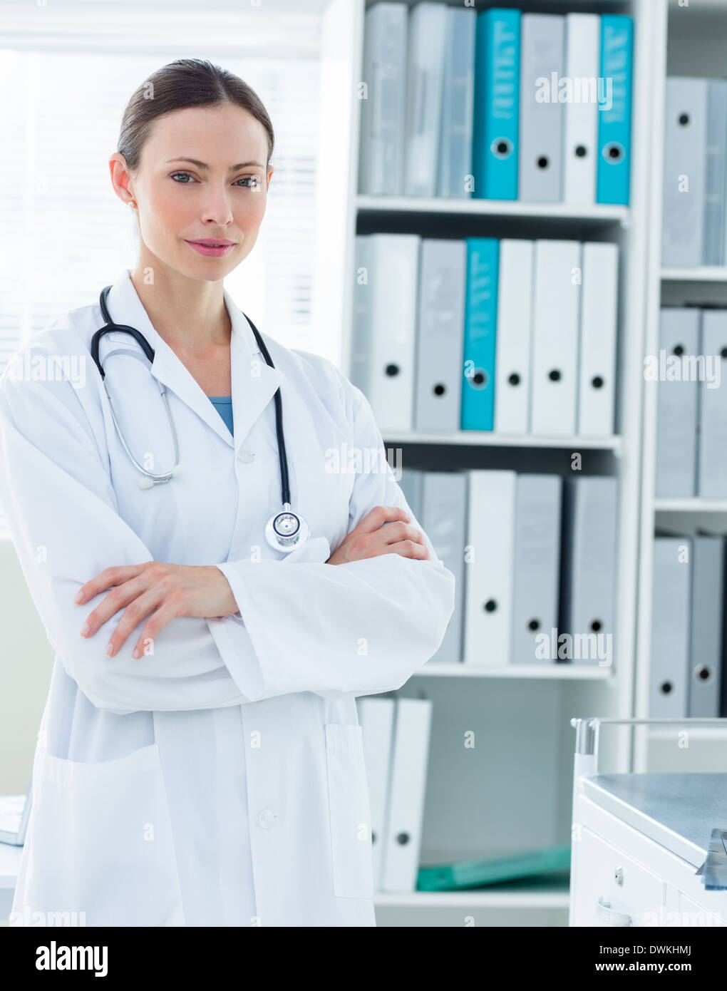 Confident doctor standing arms crossed Stock Photo - Alamy