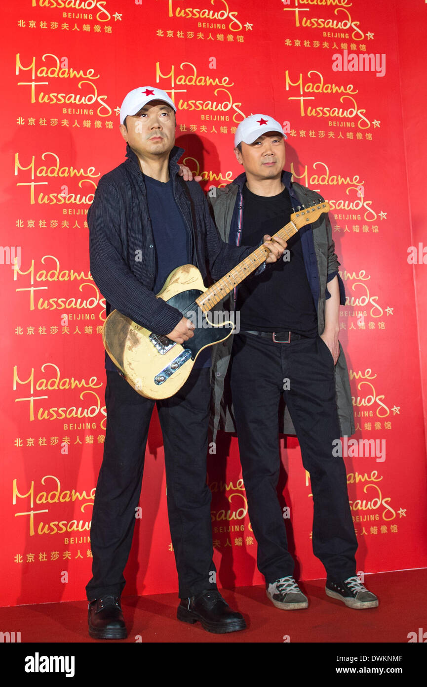 Beijing, China. 11th Mar, 2014. Chinese rock star Cui Jian (R) poses ...