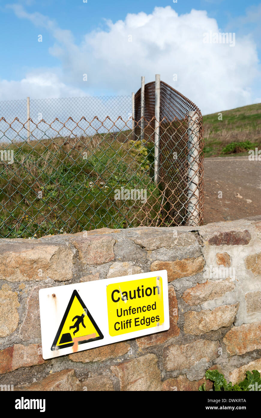 a " caution unfenced cliffs " sign Stock Photo - Alamy