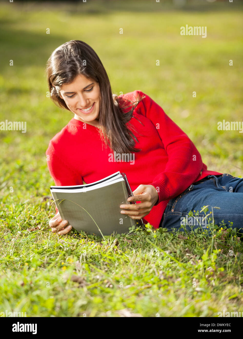 Woman reclining on grass hi-res stock photography and images - Alamy