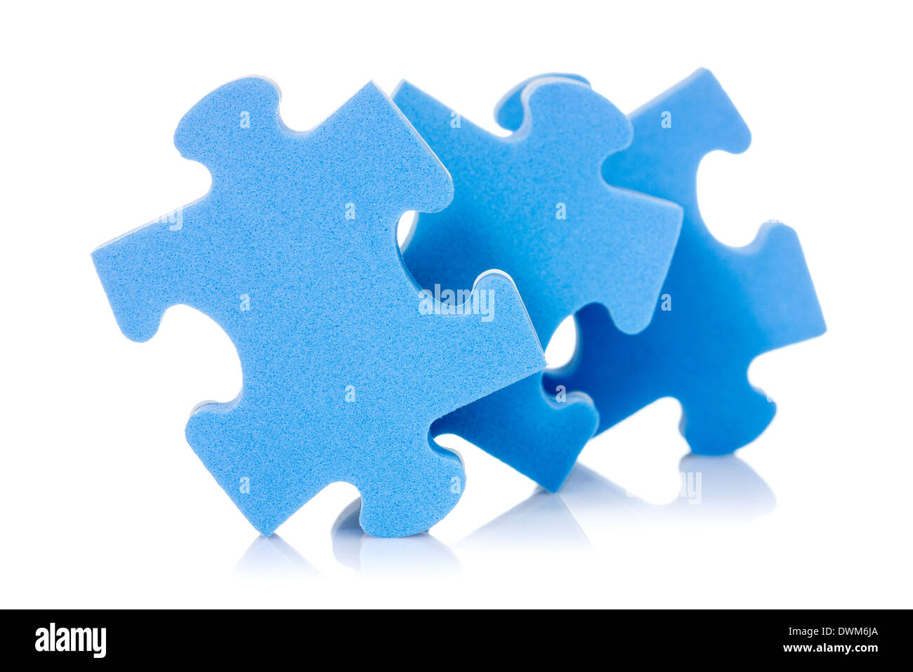 Three puzzle pieces with reflection on white background Stock Photo - Alamy