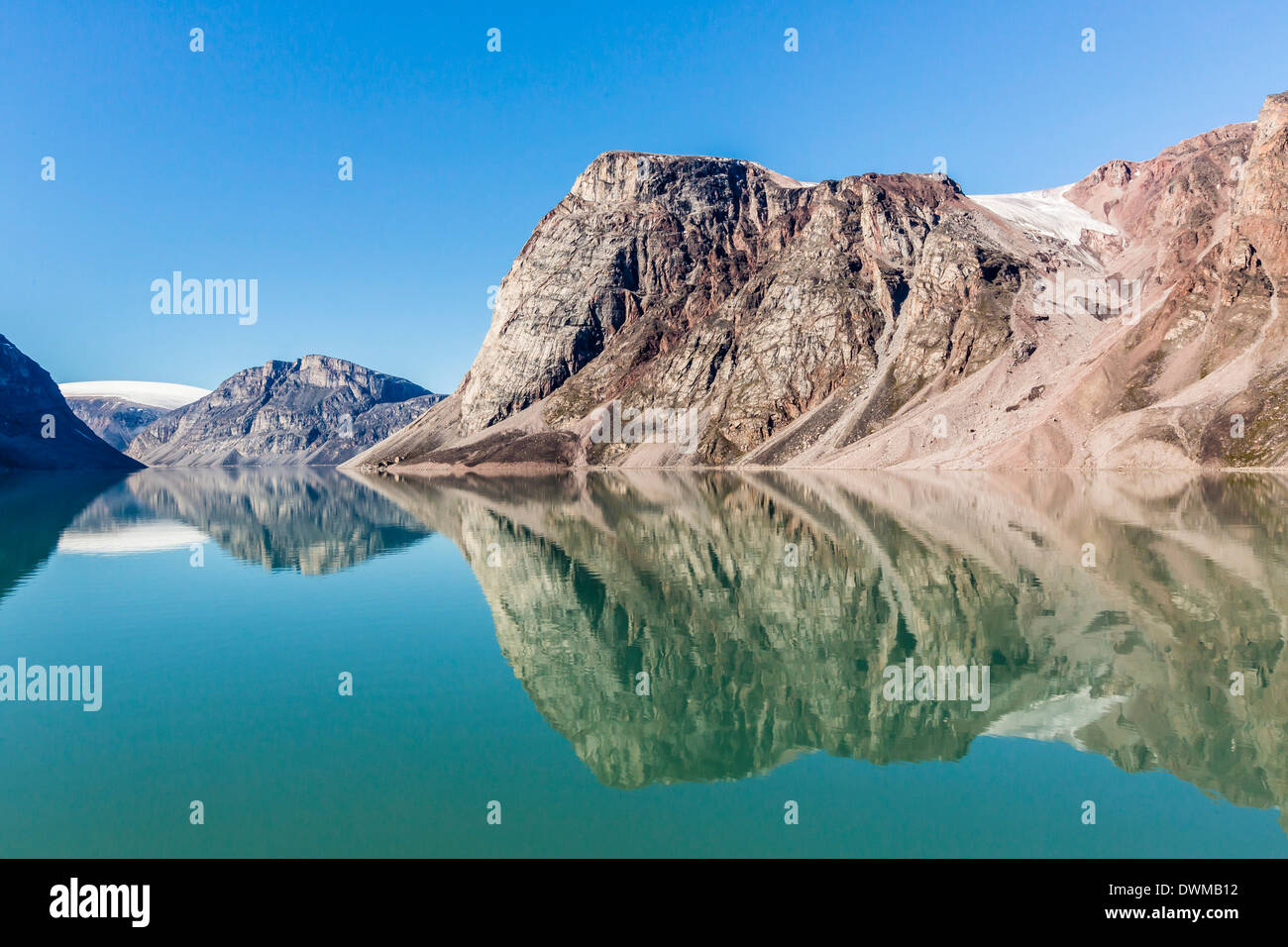 Reflections on a calm sea of the steep cliffs of Icy Arm, Baffin Island ...
