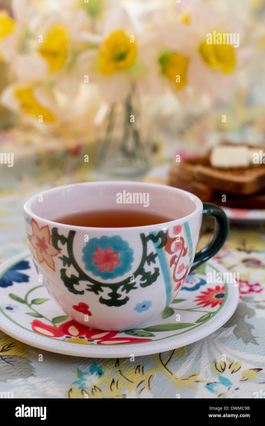 A cup of tea with toast in a colorful morning setting Stock Photo - Alamy