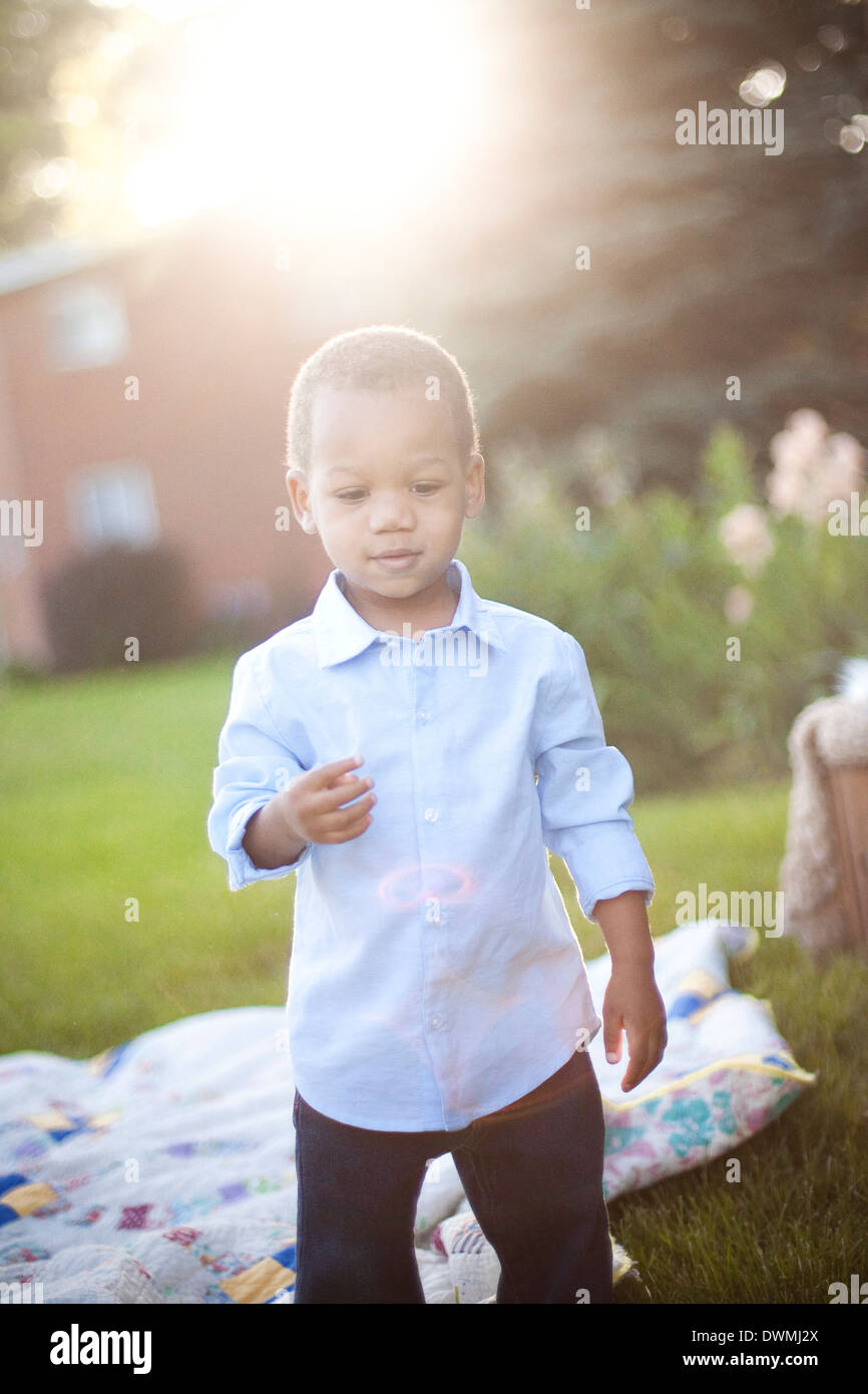 Boy in sun Stock Photo - Alamy