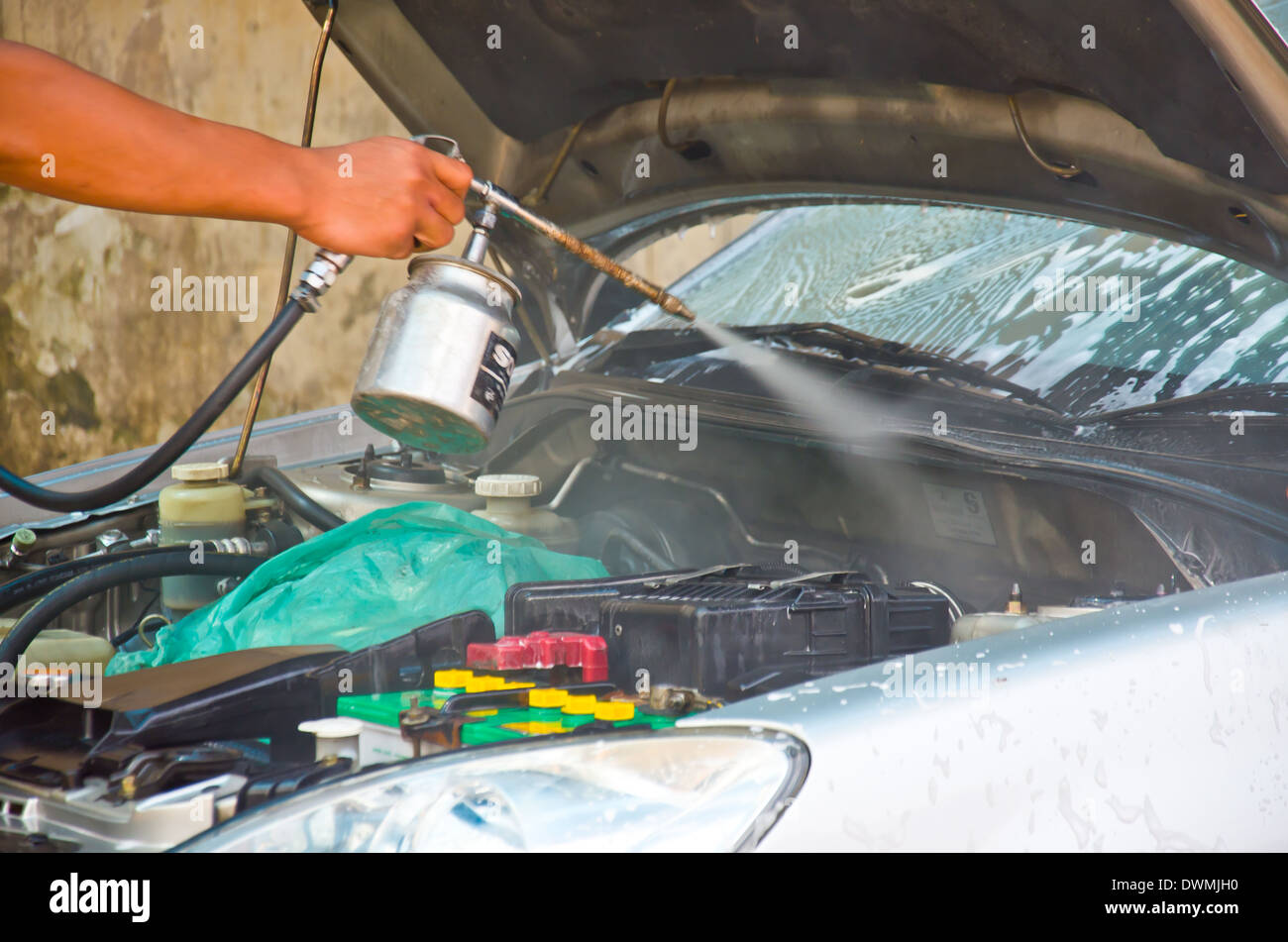 cleaning car engine from car care clean service Stock Photo - Alamy
