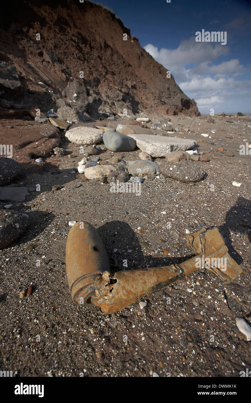 Unexploded bomb munitions exposed by coastal erosion on Mappleton beach ...