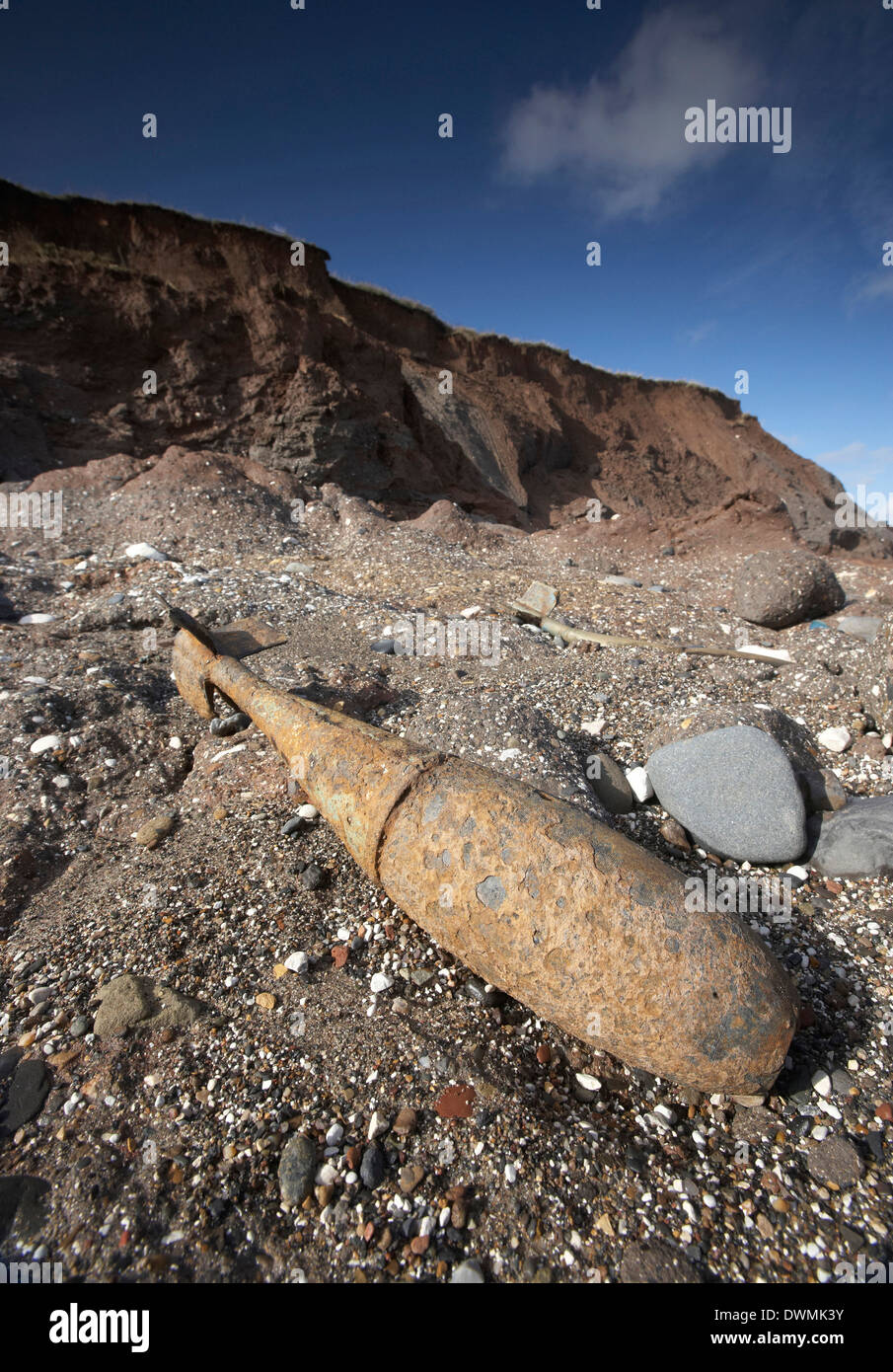 Unexploded bomb munitions exposed by coastal erosion on Mappleton beach ...